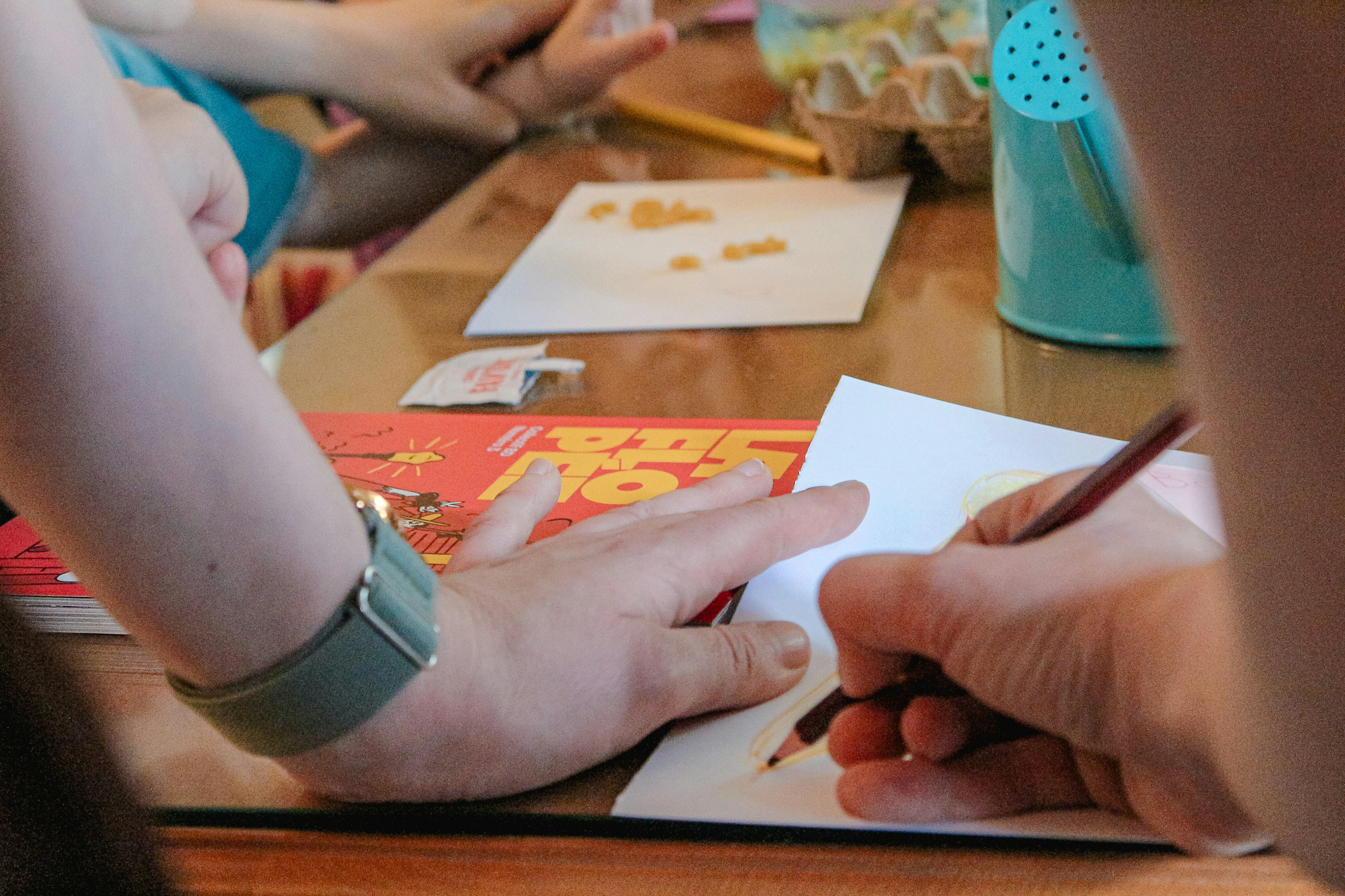 Hands at a Desk: Crafting Kindness on Paper