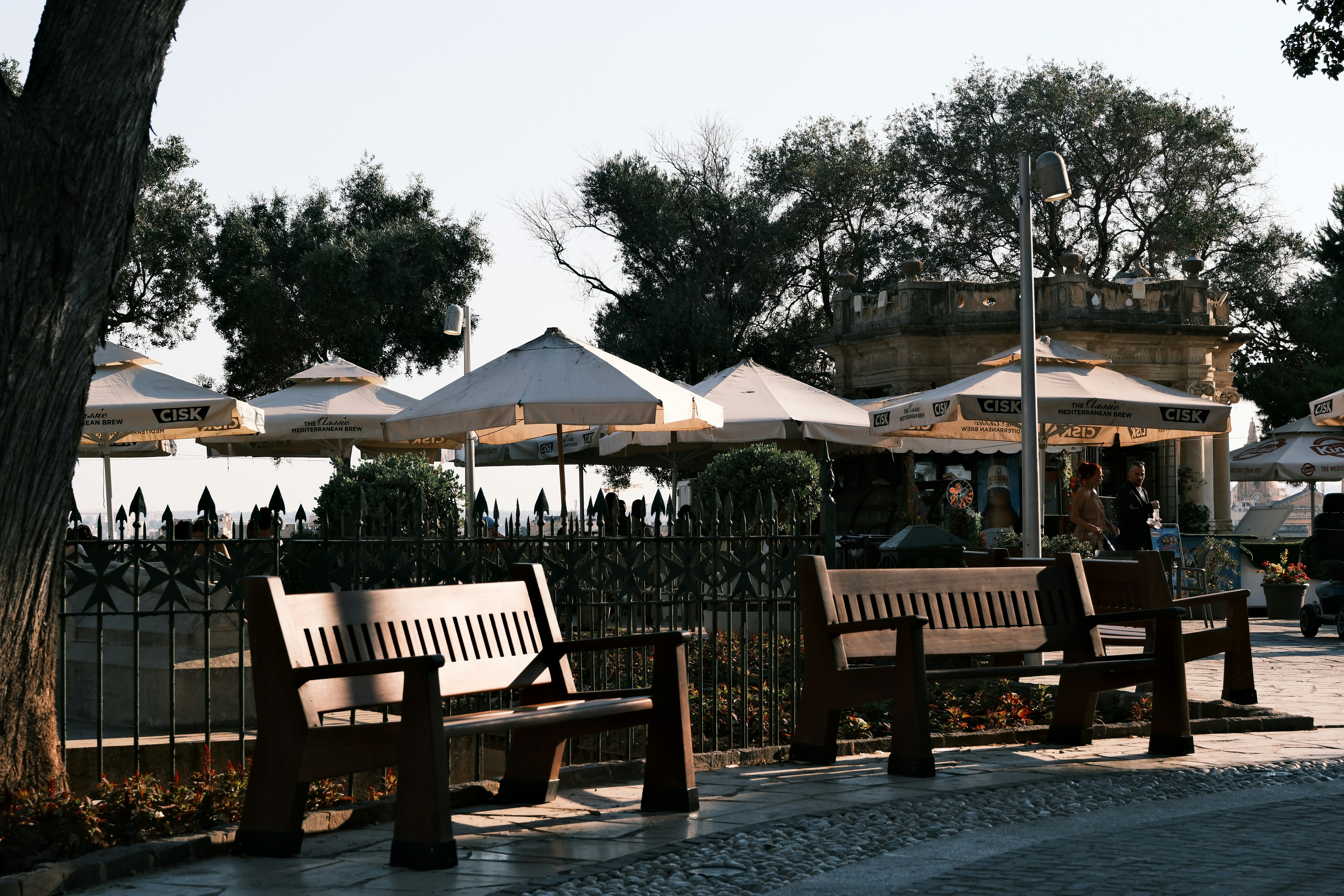 Busker’s Terrace: Calm Café Scene by the Waterfront