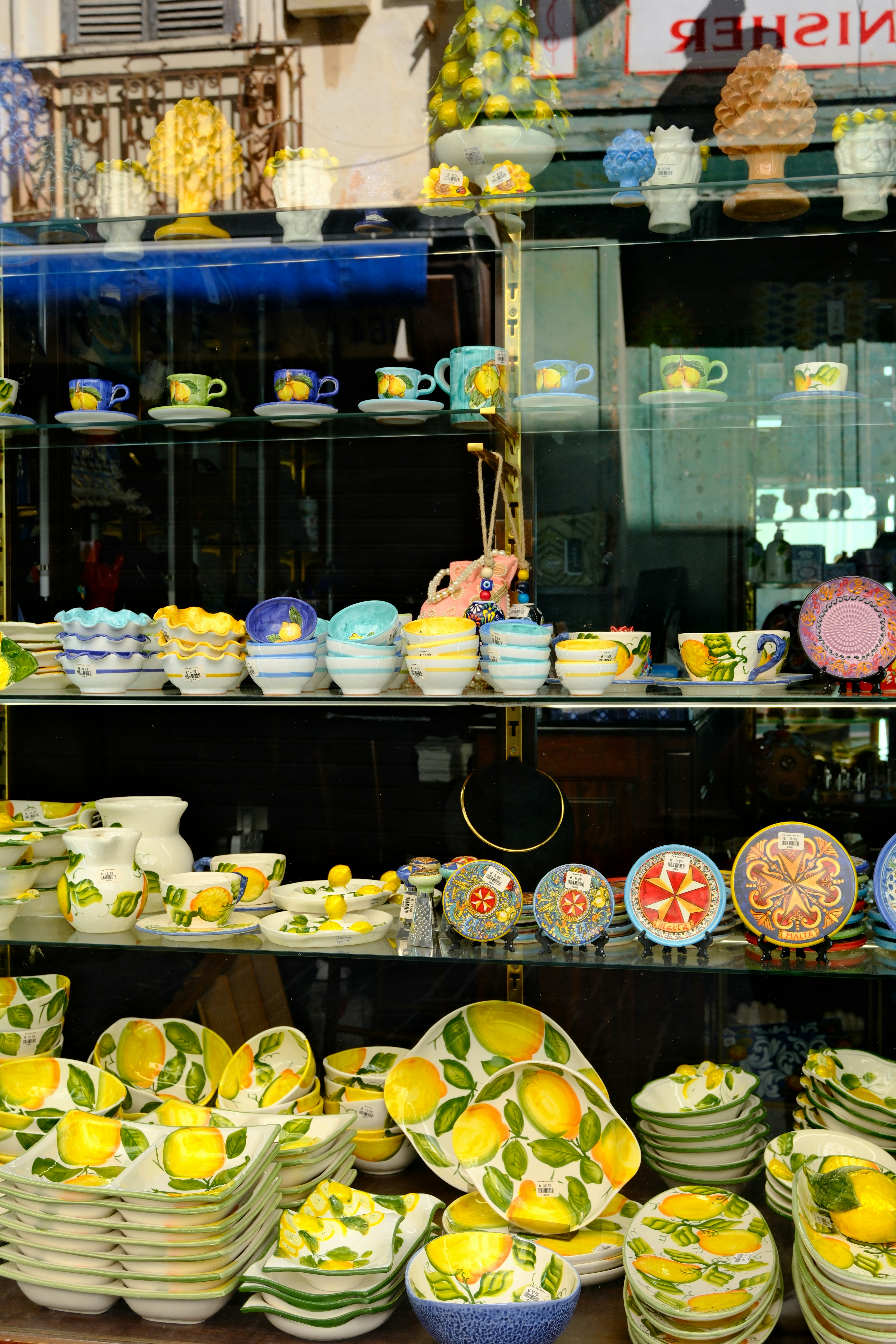Colorful Ceramic Market Window: A Symphony of Dishes and Patterns