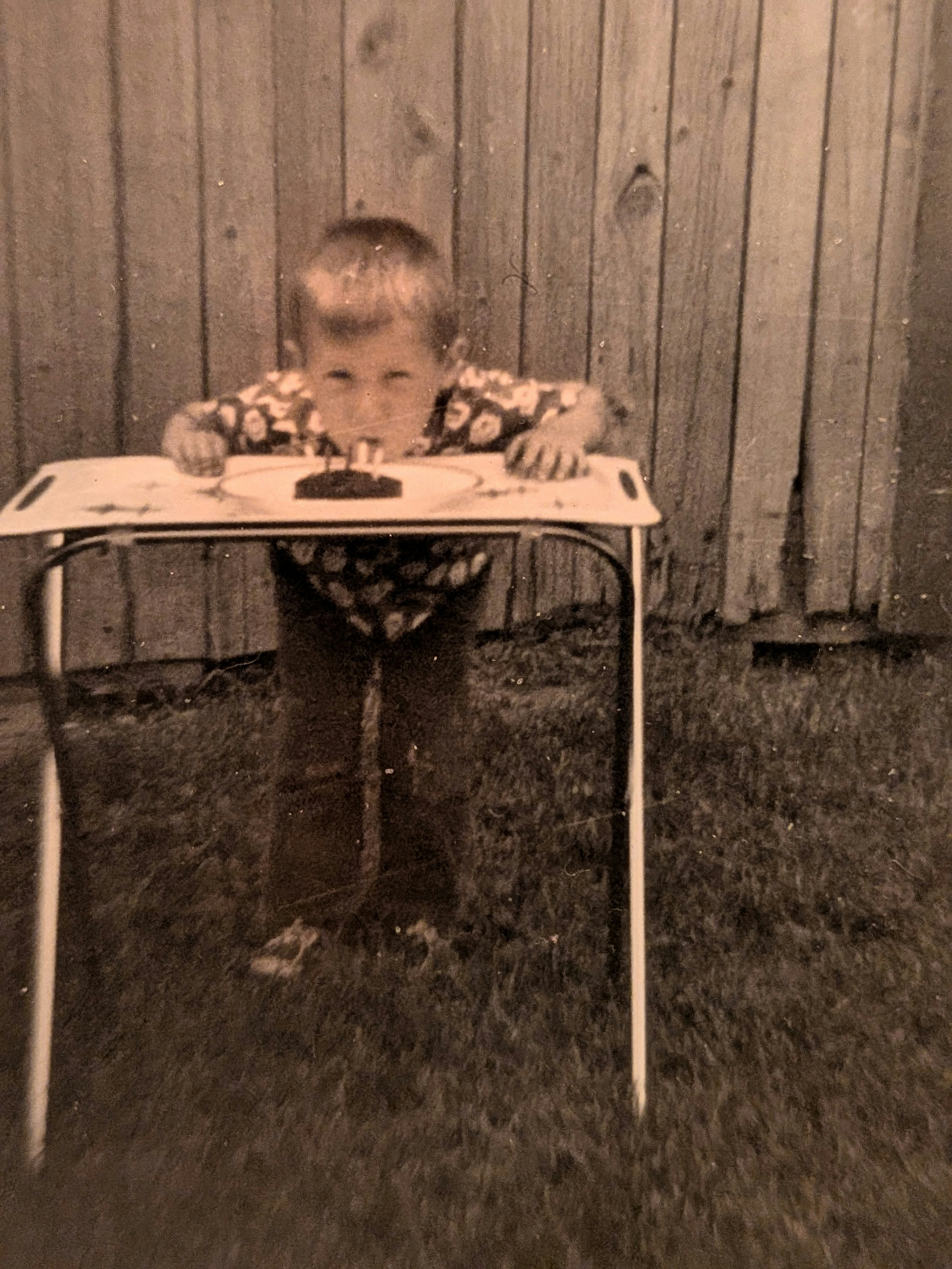 Young Birthday Moment: A Tiny Celebrant at the Kiddie Table