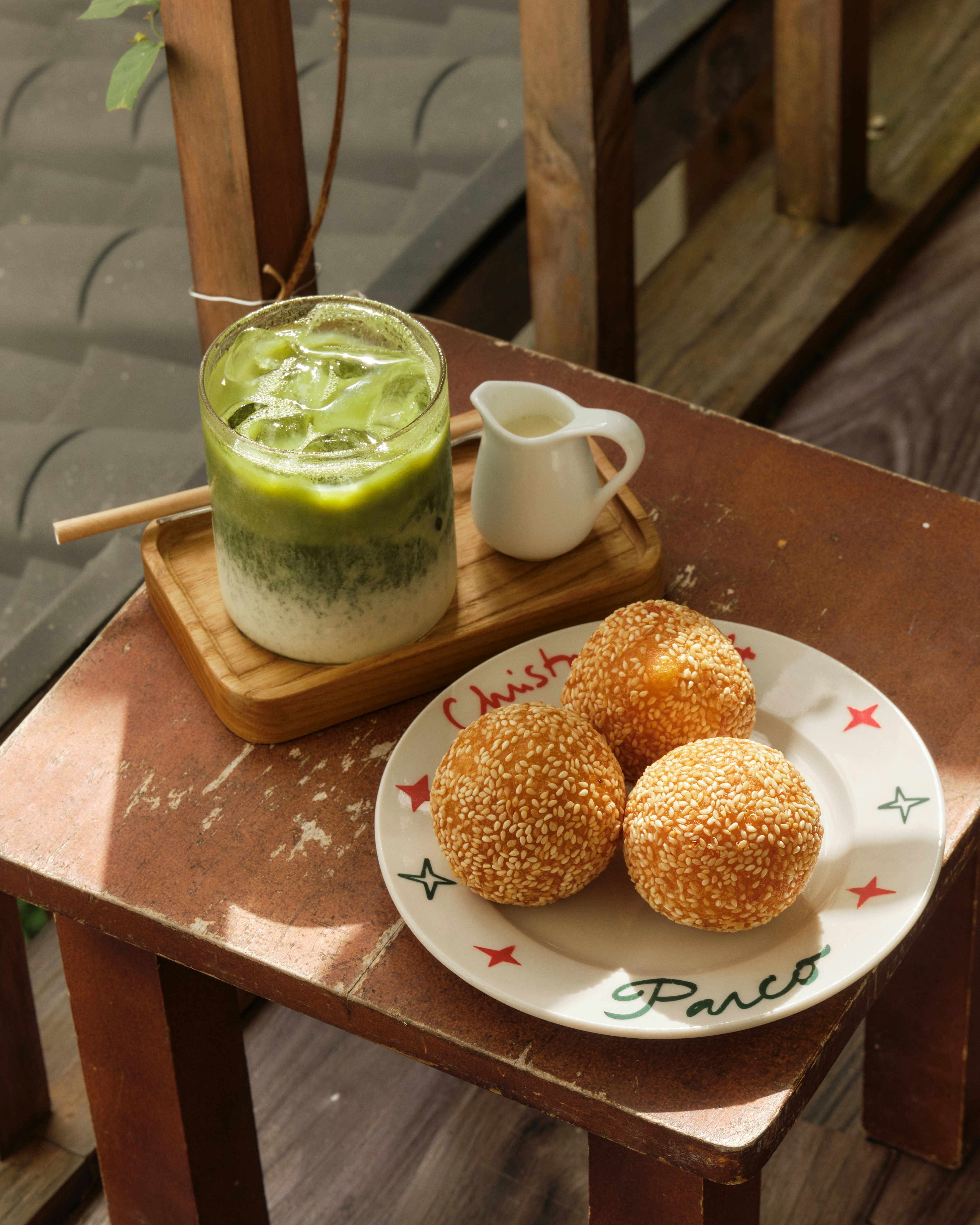 Green Matcha with Sesame Treats on a Cozy Balcony Table
