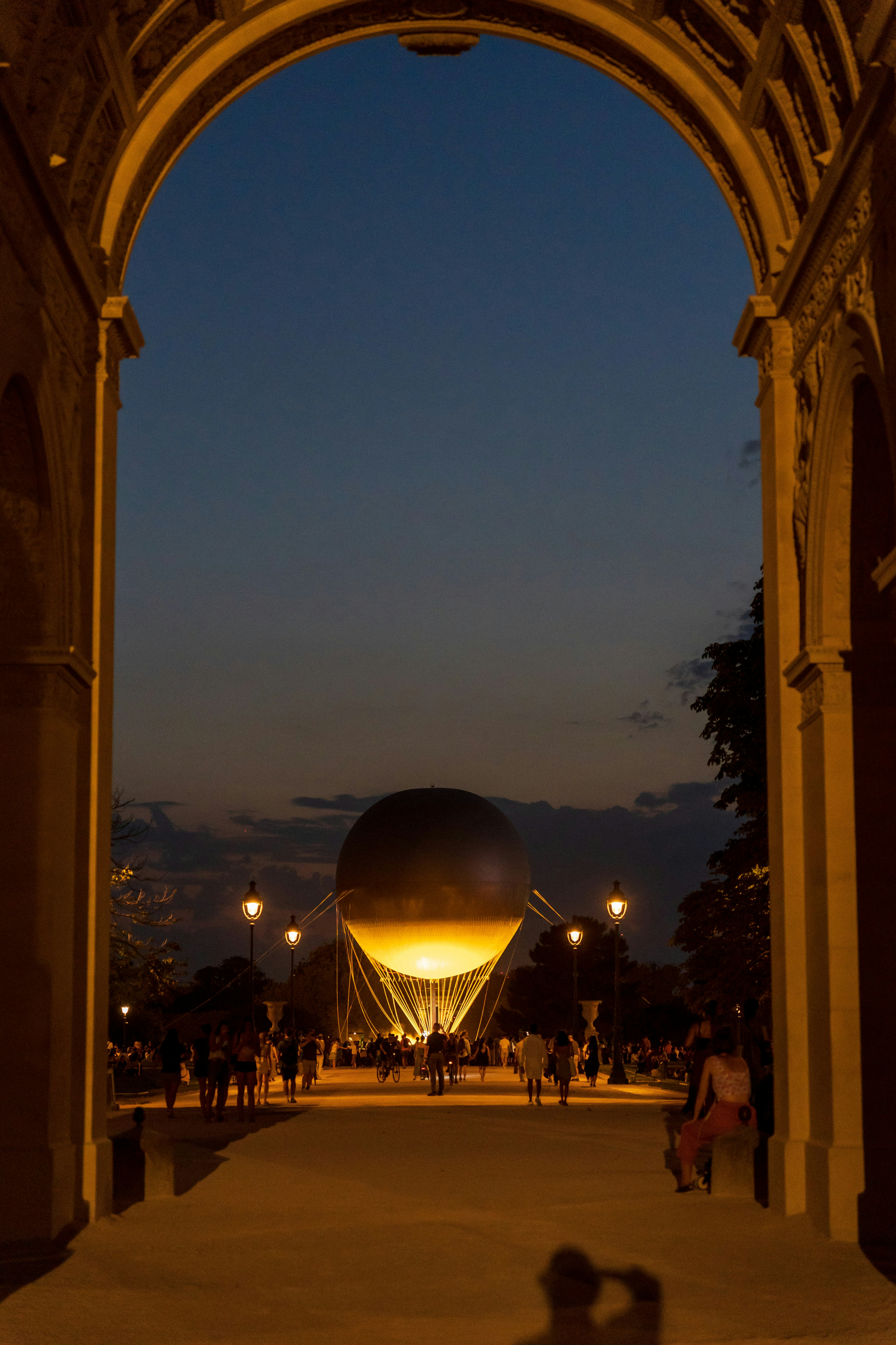 Lamp-lit Archway Framing a Balloon Lantern Festival