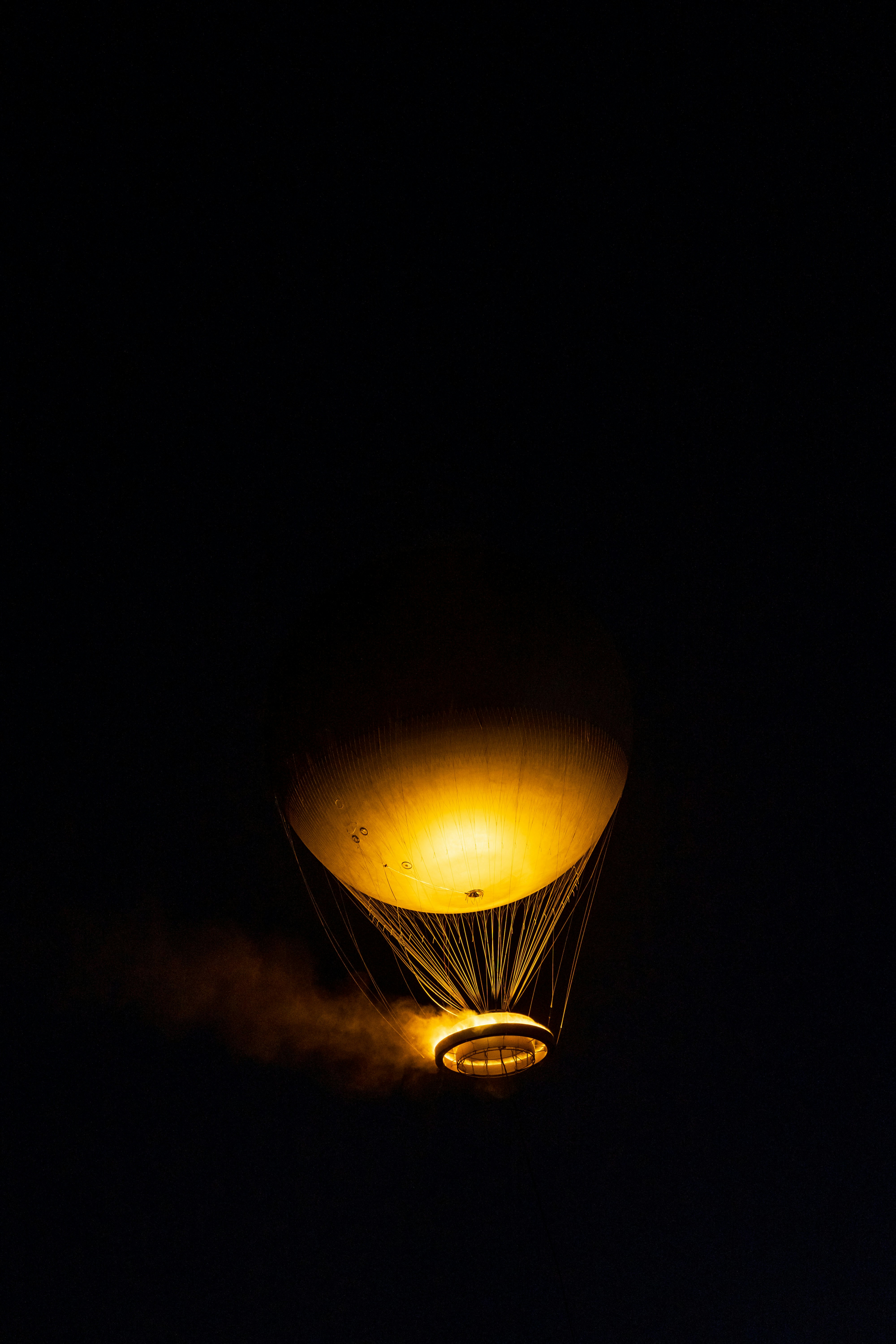 Night Flight: Glowing Balloon Ascends Against Velvet Sky