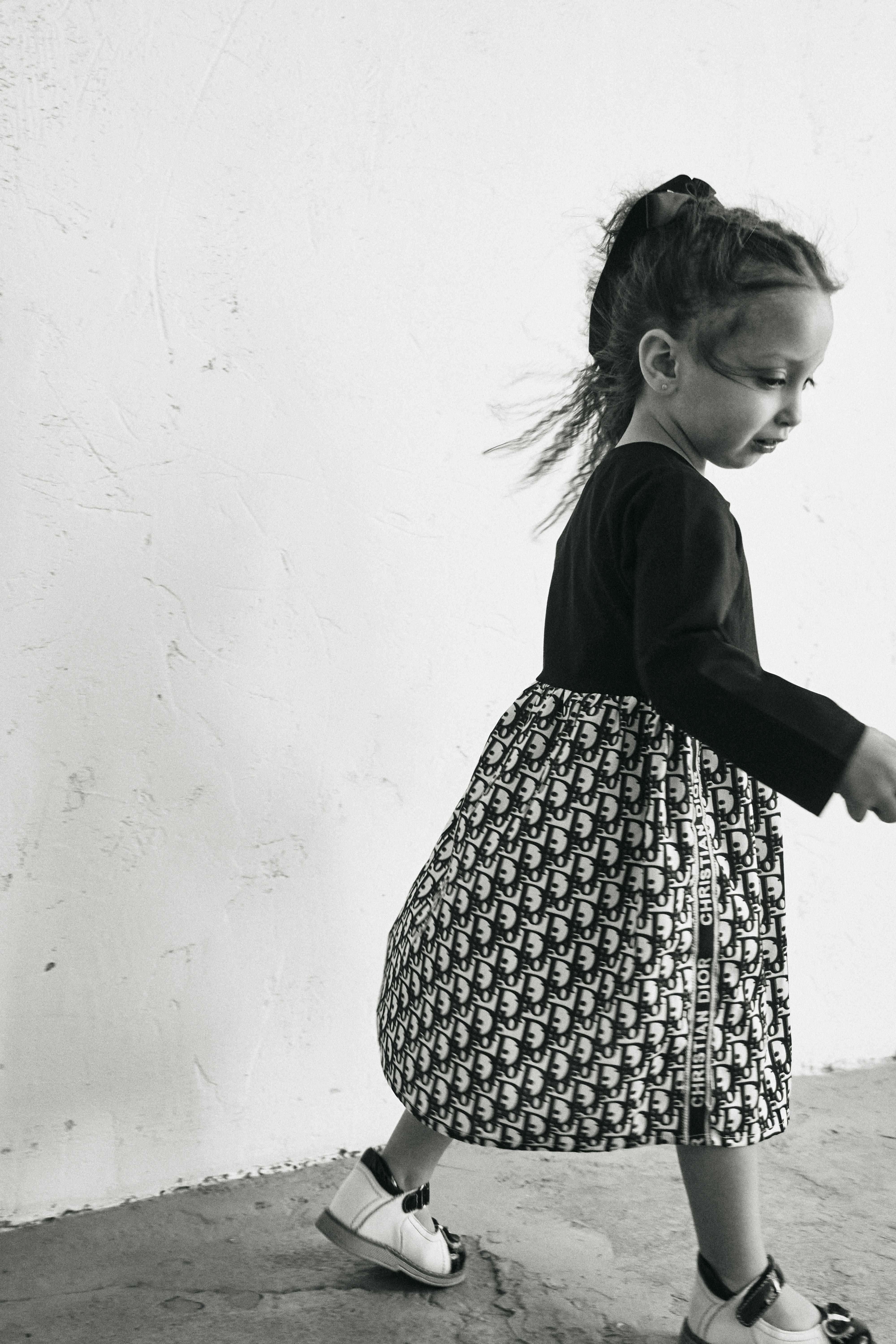 Little Dancer in Motion: A Black-and-White Moment on the Run