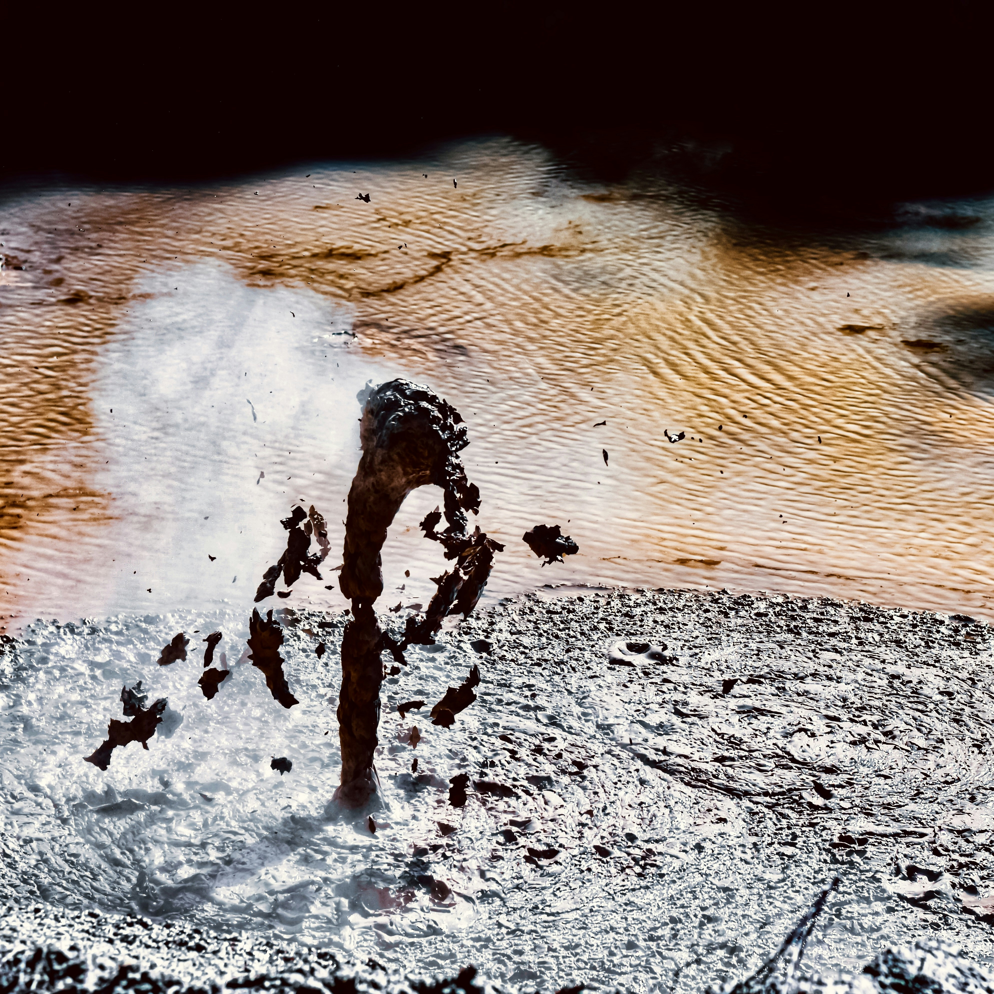 Geothermal mud pool eruption