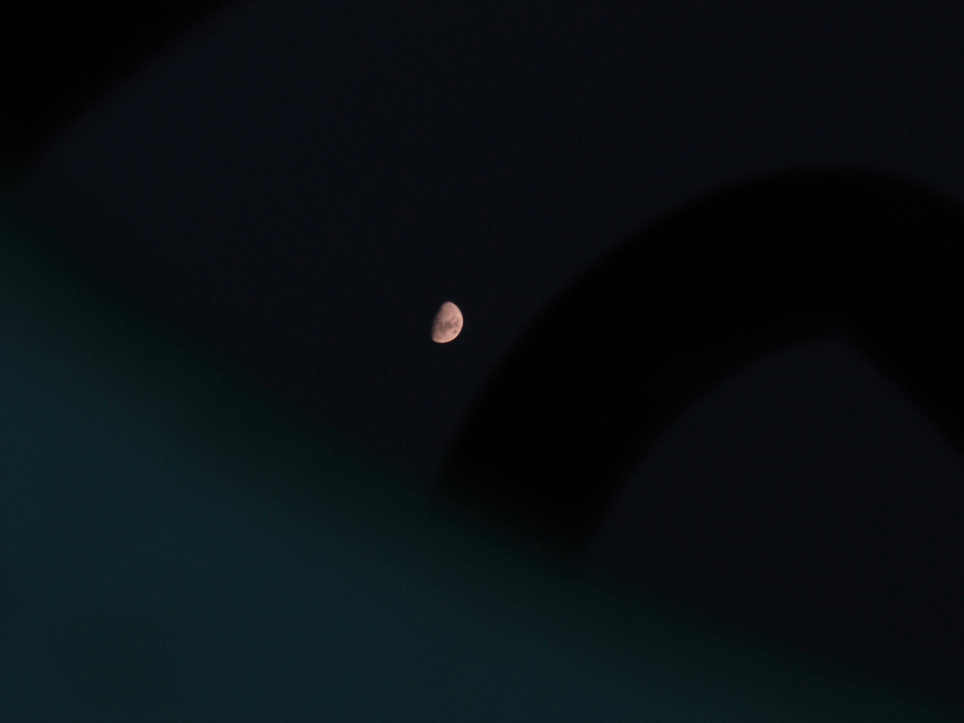 Lunar Crescent Miniature: A Sliver of Moon in Night Arc