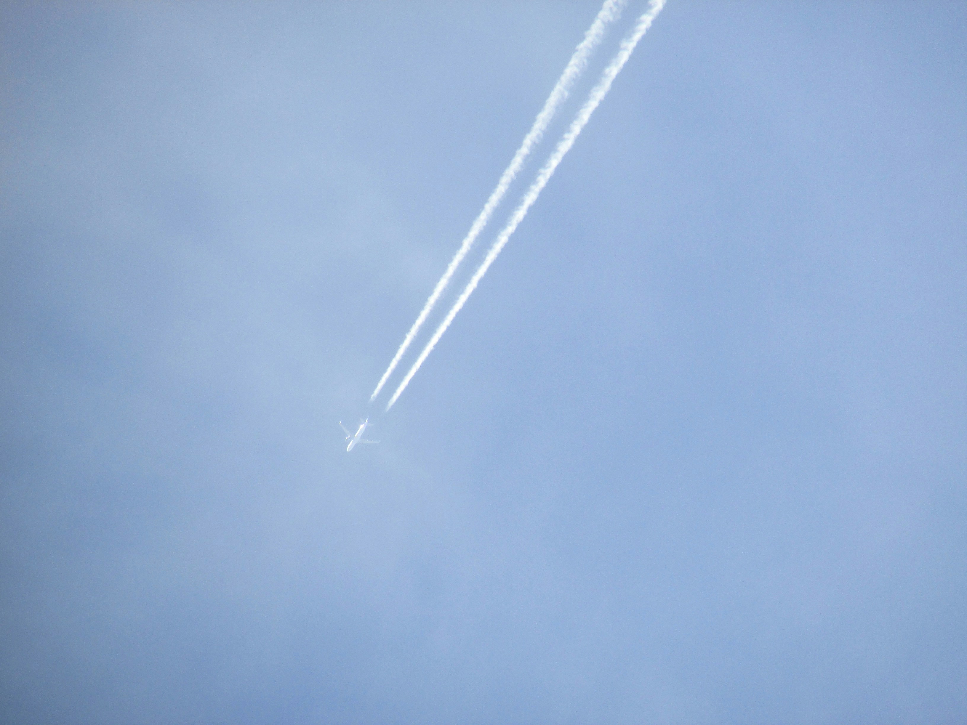 Contrail Arrow: Dual Vapor Trails in a Clear Blue Sky