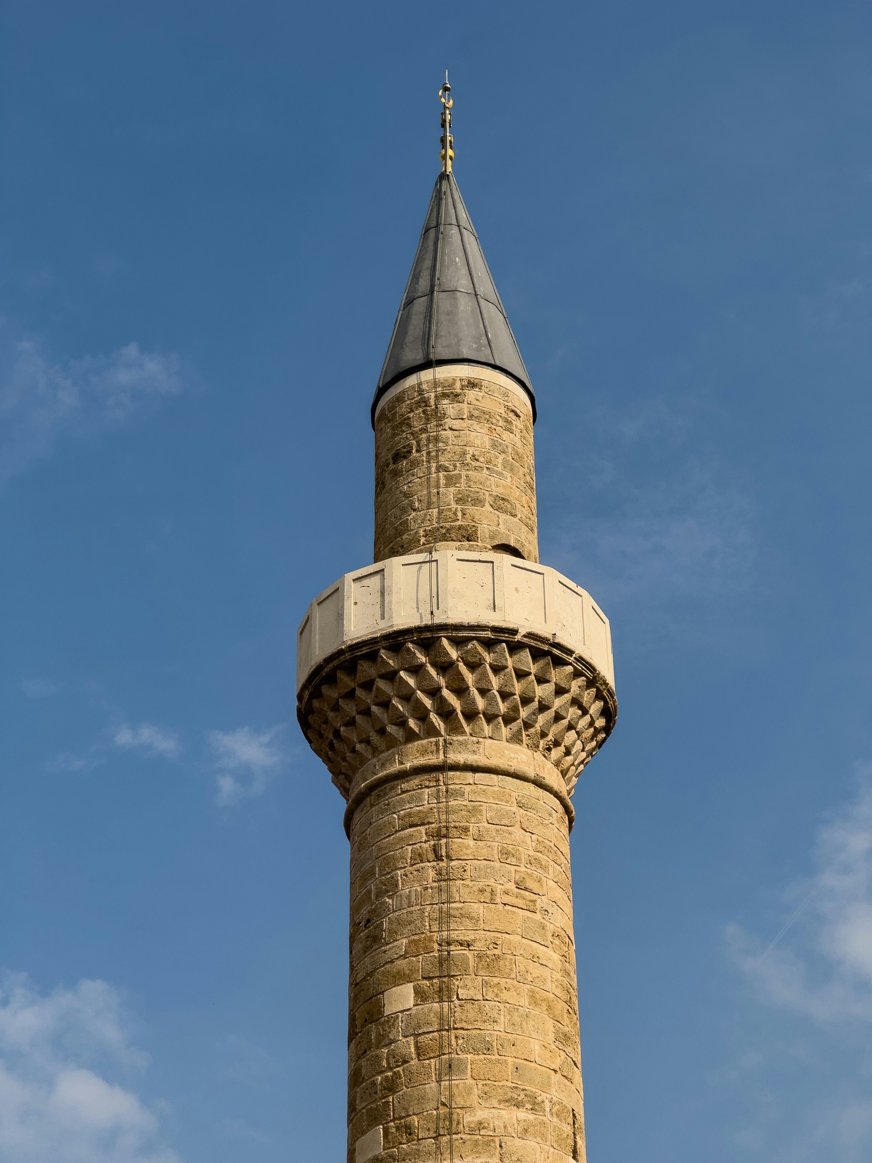 Spire Rising: A Stone Tower Against a Clear Sky