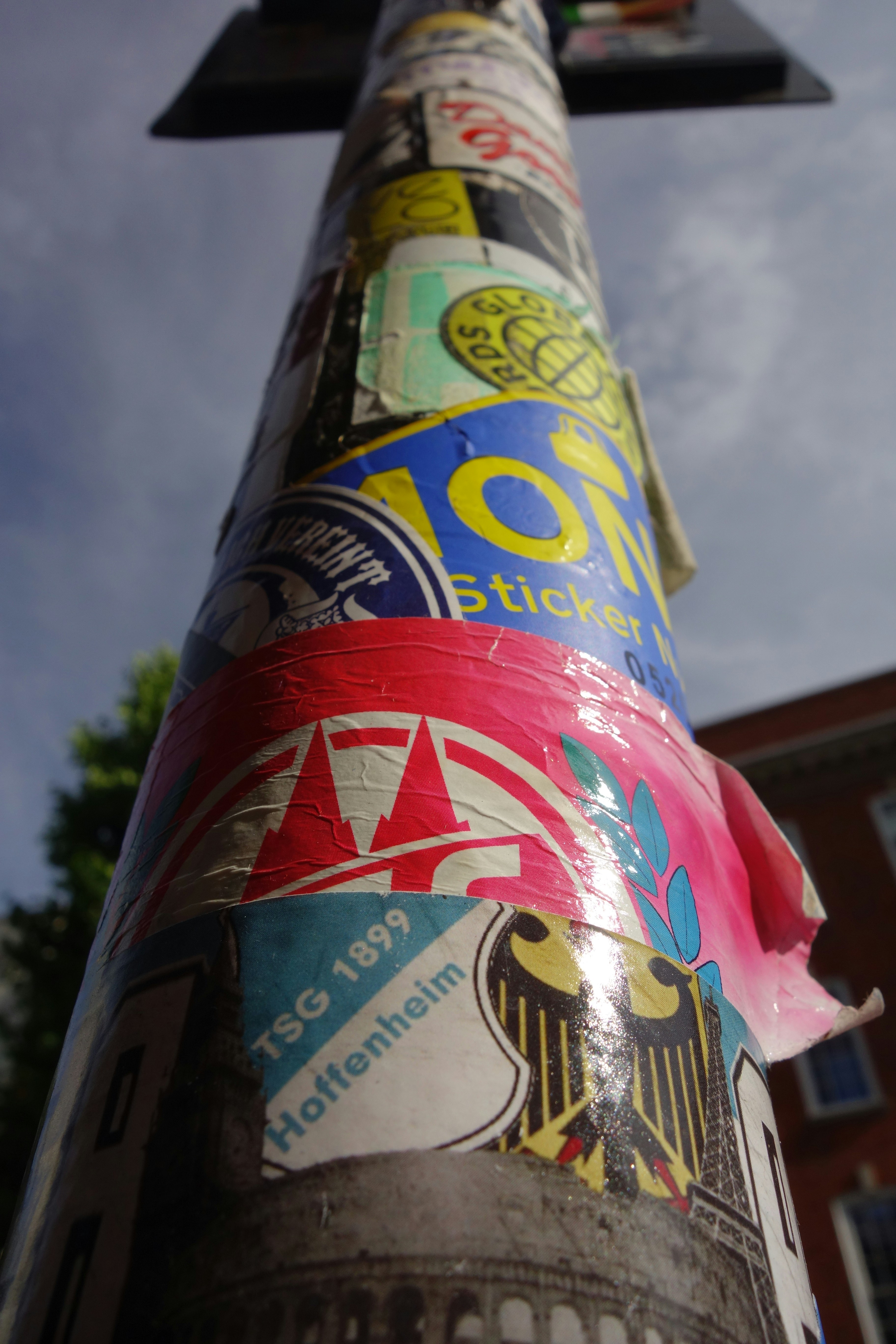 Stickered Pole Reaching Toward Sky