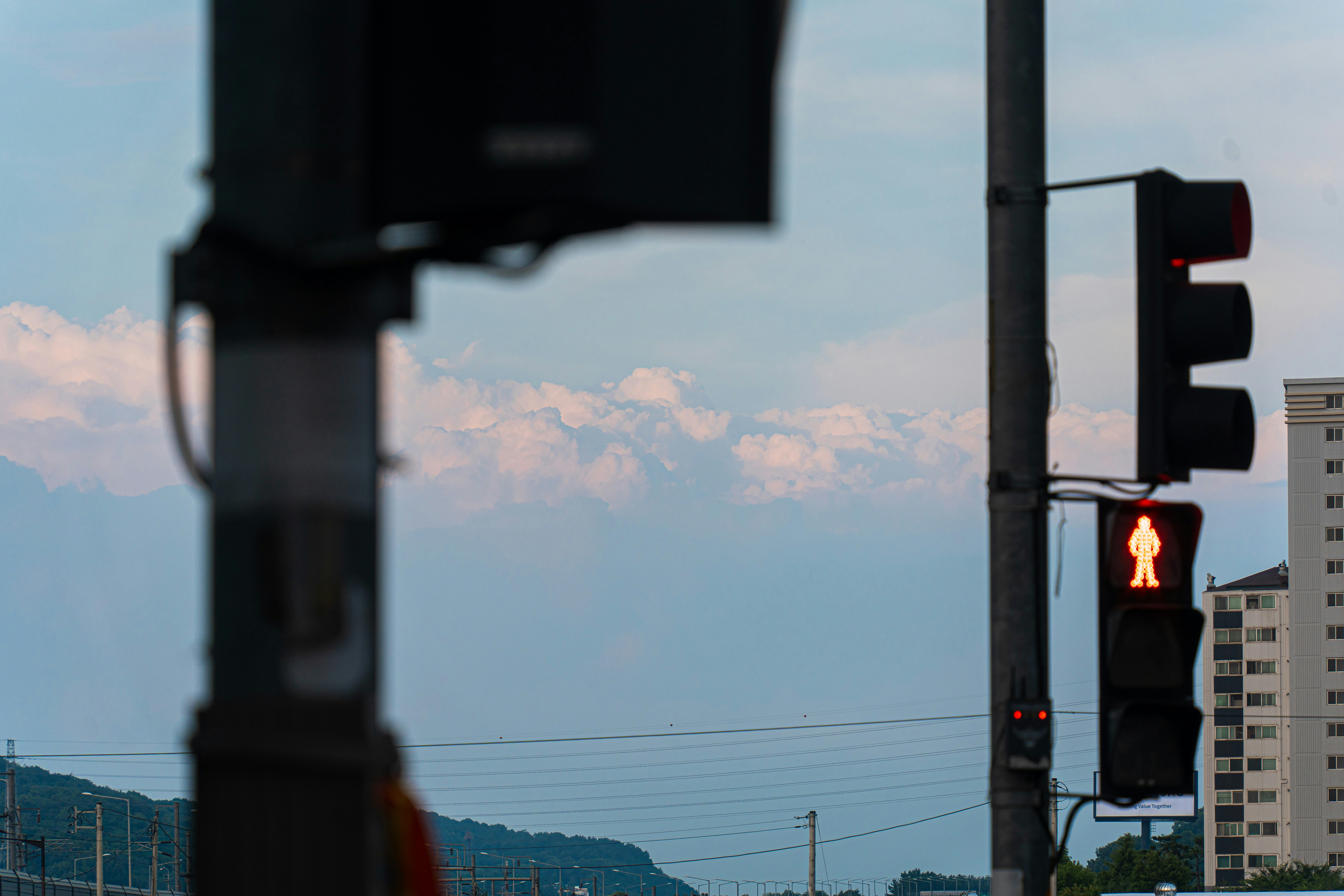Awaiting the Light: Pedestrian Signal at a Quiet City Crossing