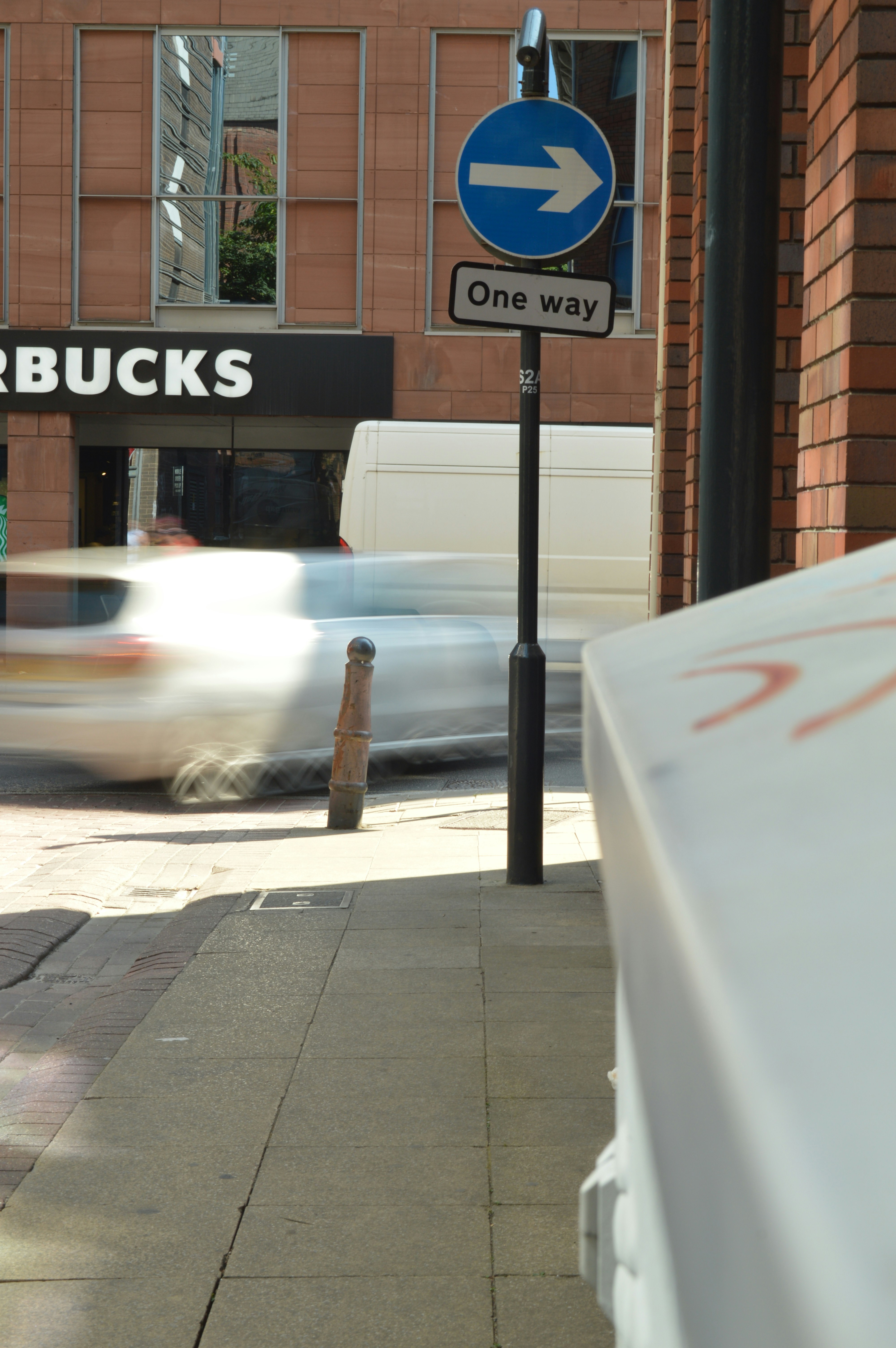 Motion in the Urban Speed: A Blur of Traffic and Silence at the One-Way Gate