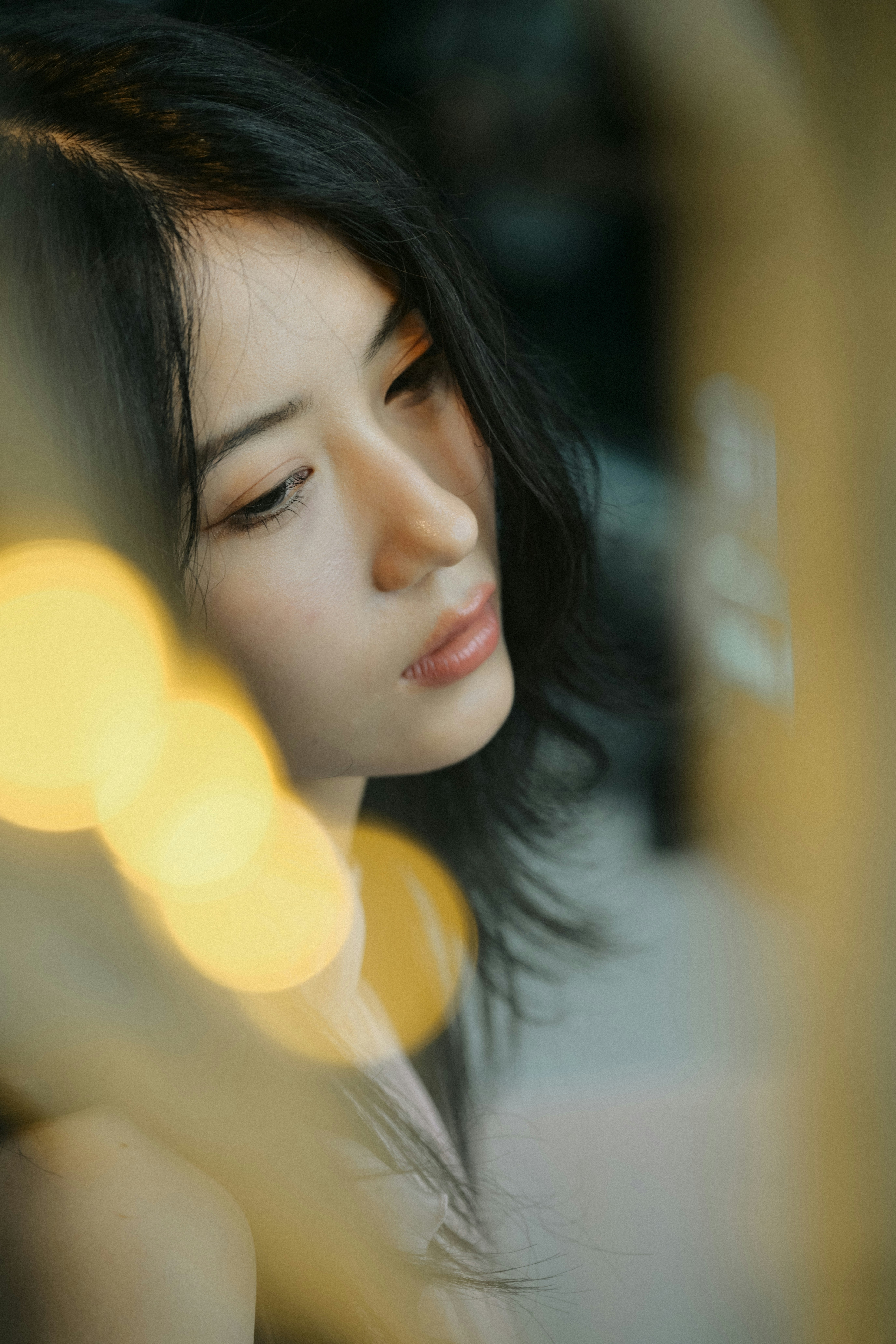 Soft Gaze Through Warm Bokeh Lights
