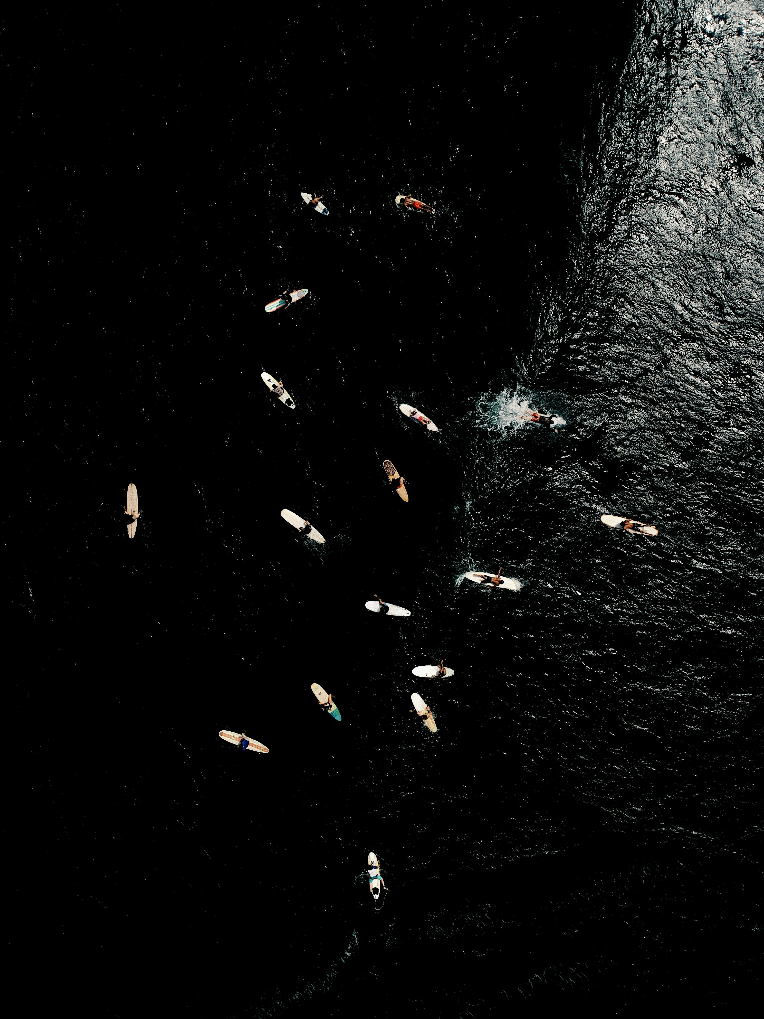 Aerial Constellation: Kayaks of Light on Midnight Water