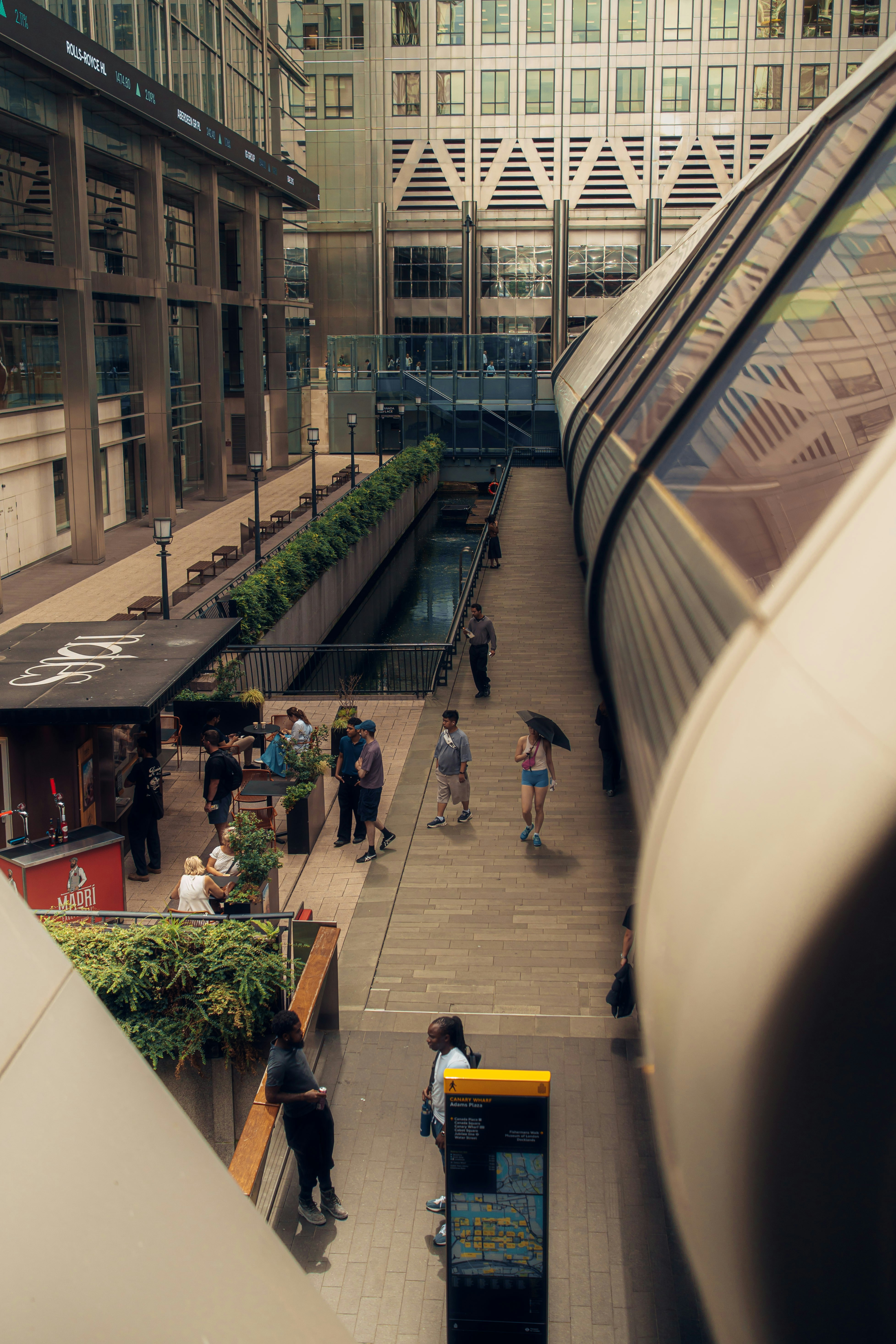 Urban Twin Arc: A Rooftop Vantage Over a Busy Courtyard
