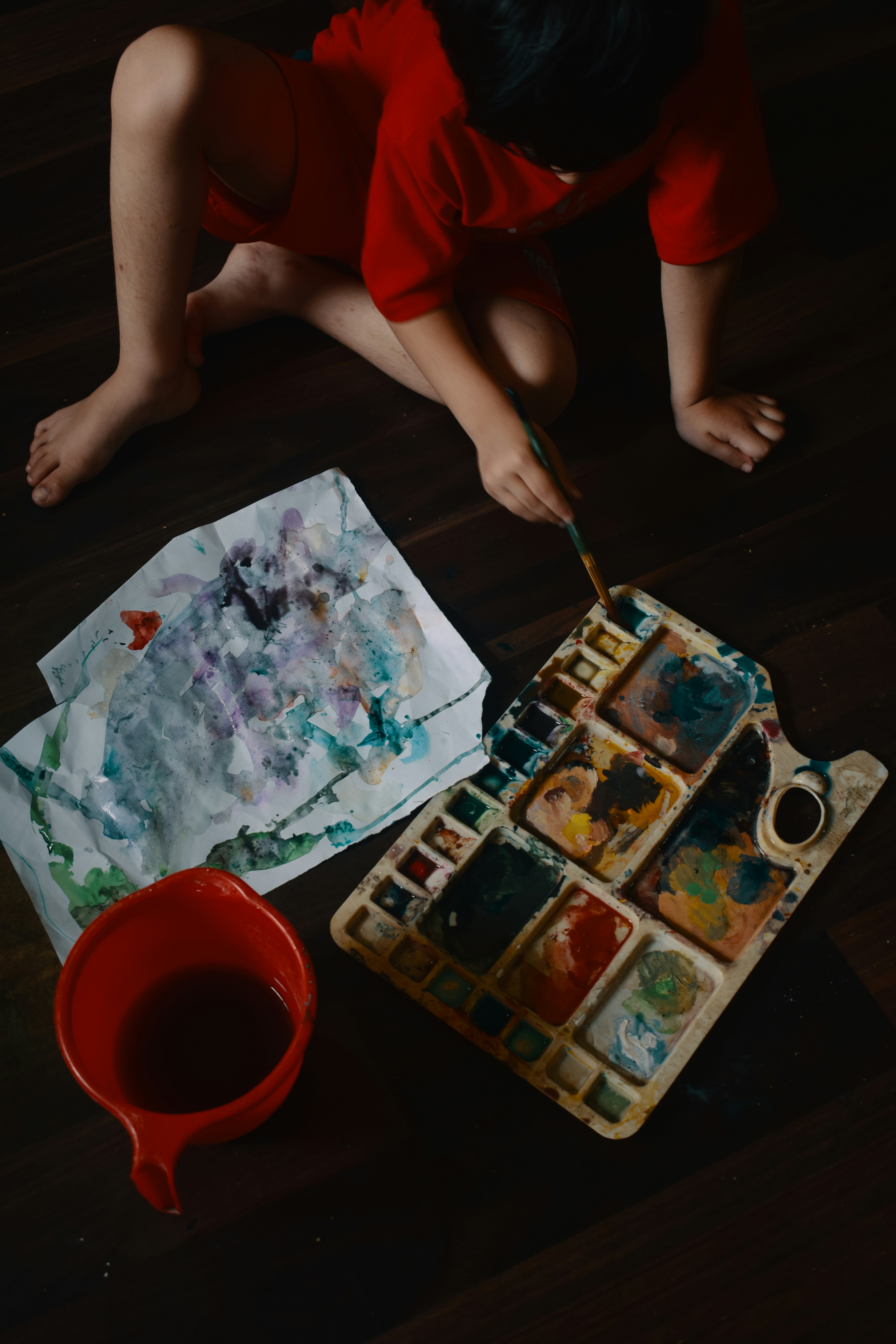 Red-dress Muse: A Child Painted in Shadows