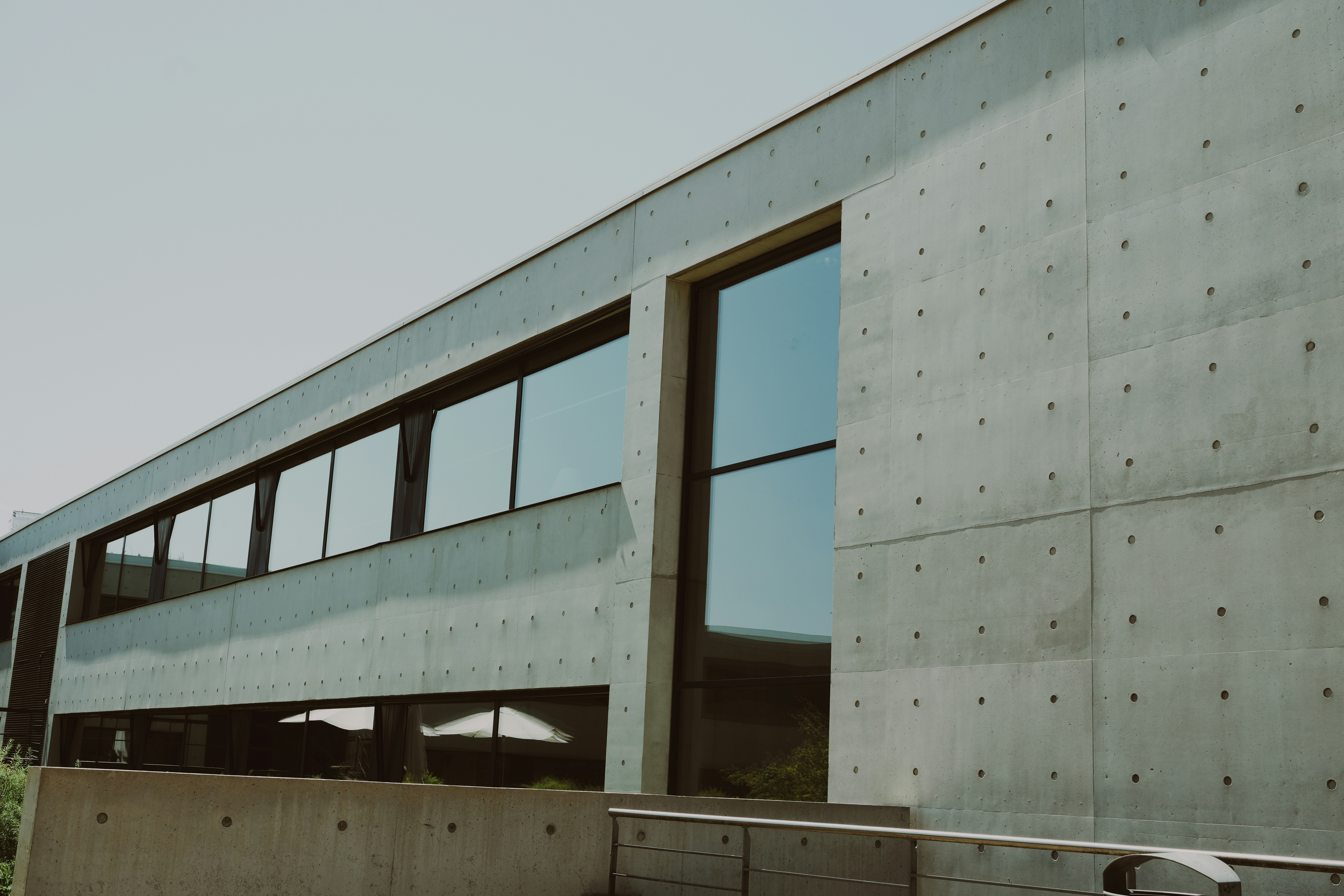 Concrete Facade, Long Shadow: Modernist Office Wing