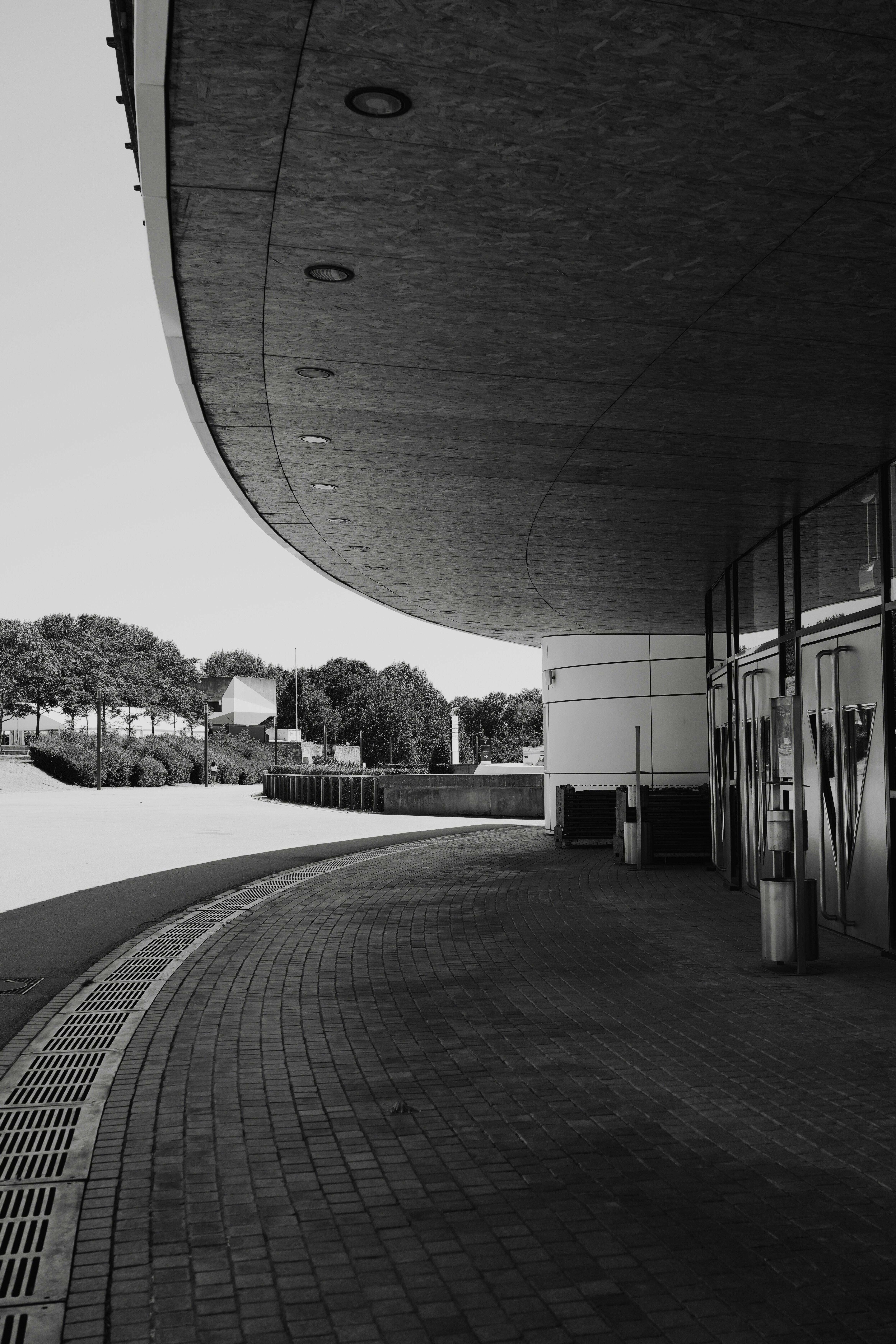 Curved Canopy Overcast: A Desaturated Walk Along Modern Facades