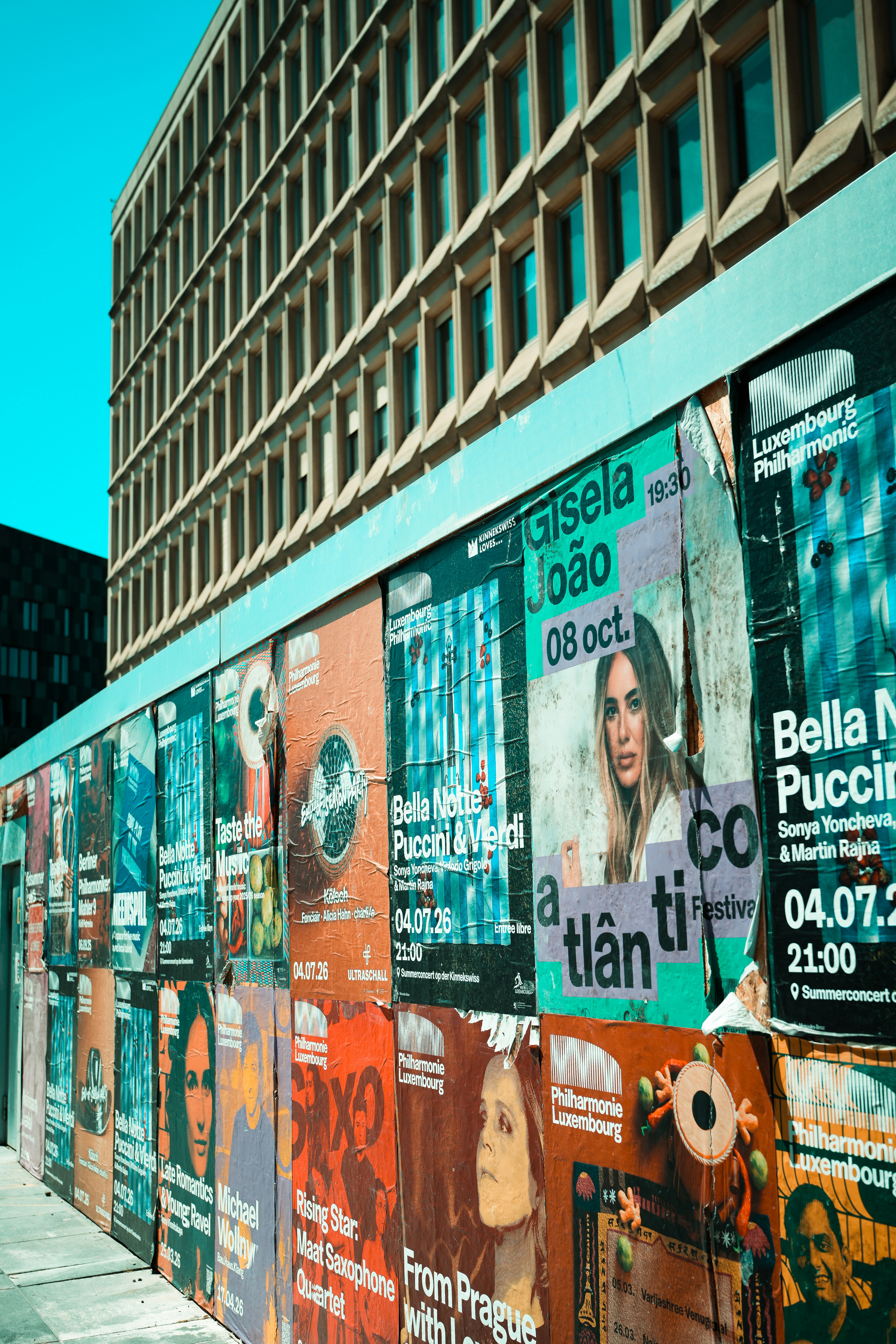 Vibrant Urban Posters Wrapped Along a Modern Facade