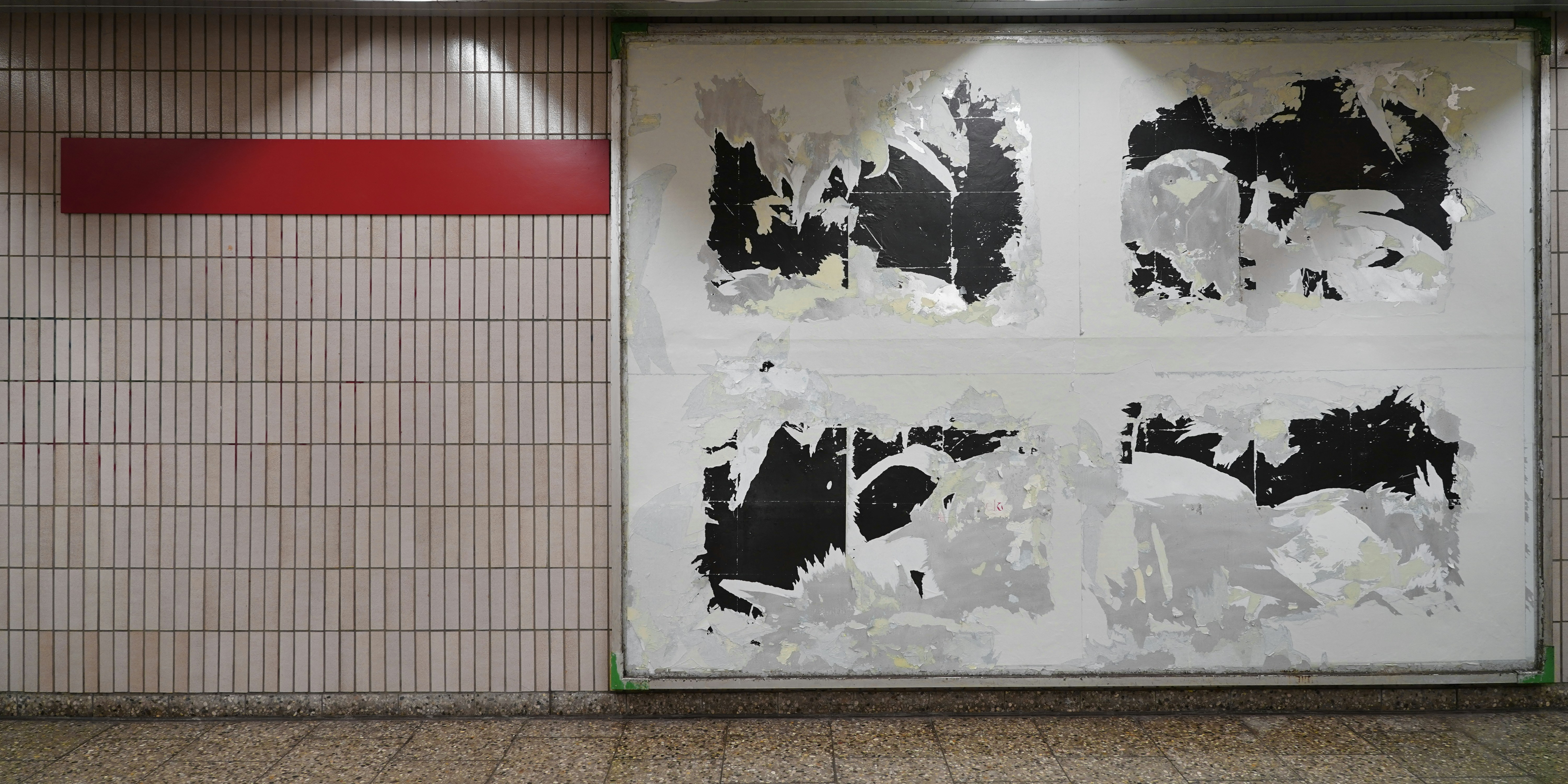 Worn Tiles and Graffiti Echoes: An Empty Subway Landing