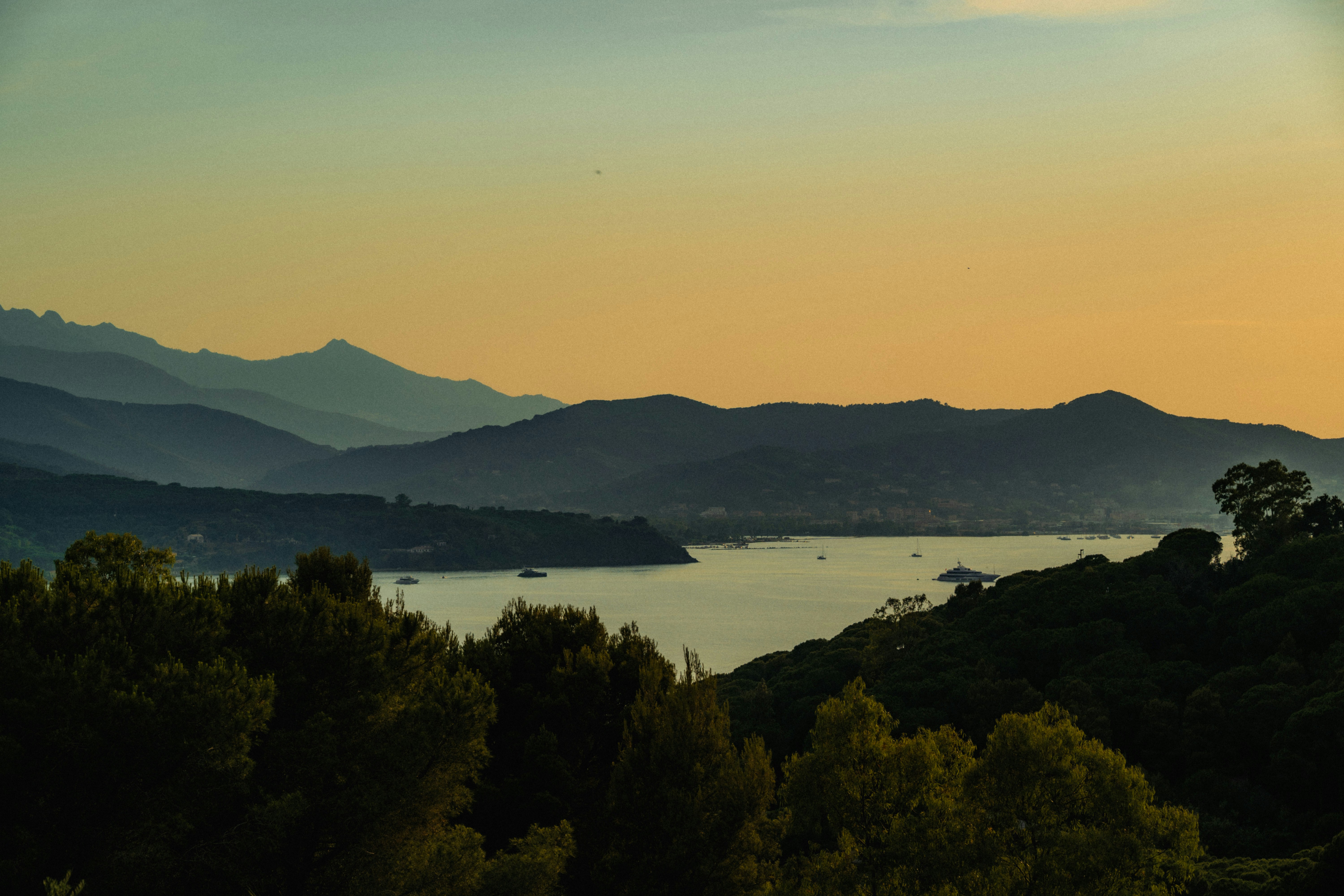 Distant Hills at Dusk Over a Serene Bay
