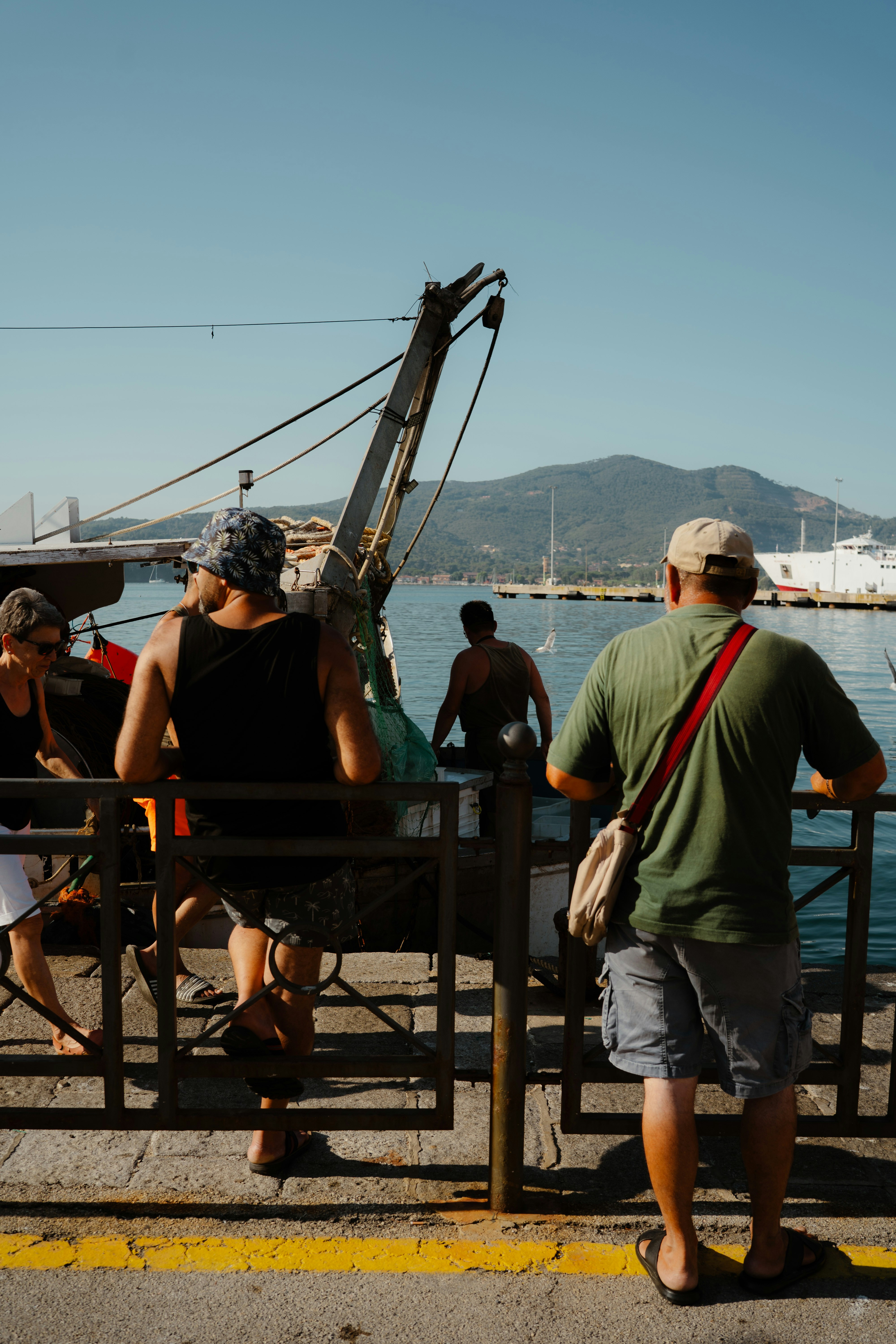 Dockside Convergence: Figures at the Edge of the Sea