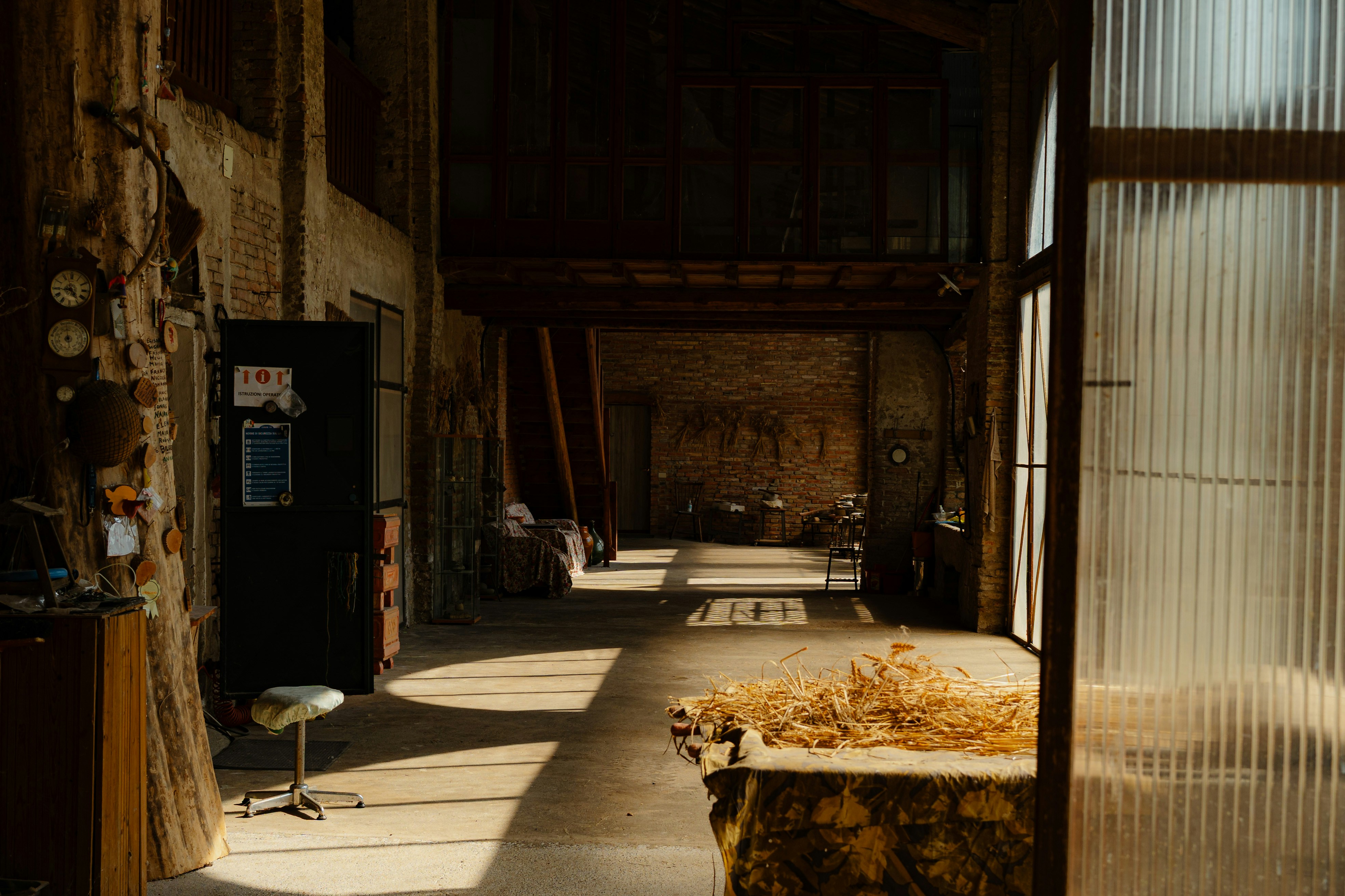 Warehouse Interior: Light Slant Through Open Doors Illuminates Central Aisle