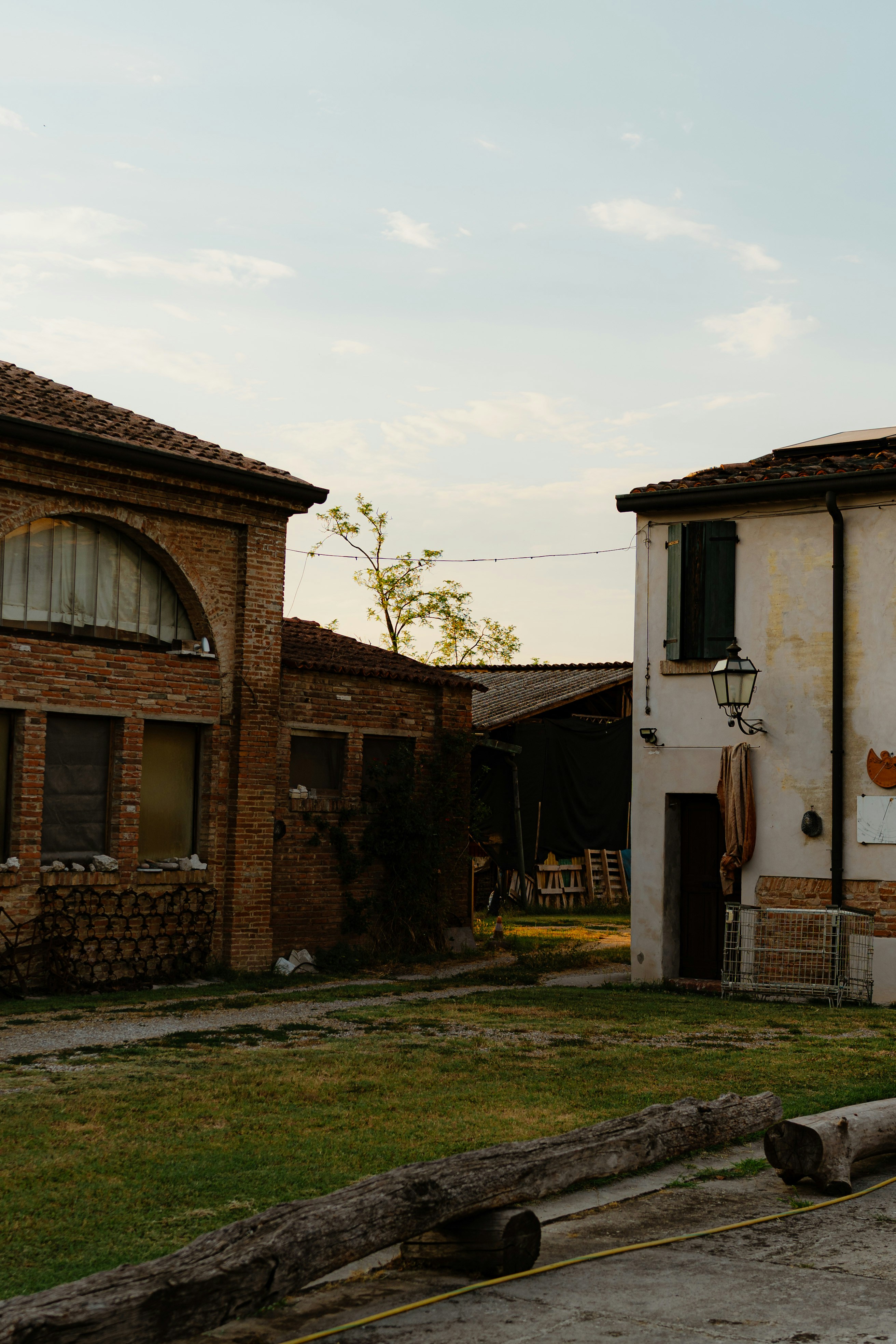 Rural Courtyard Between Brick and Plaster