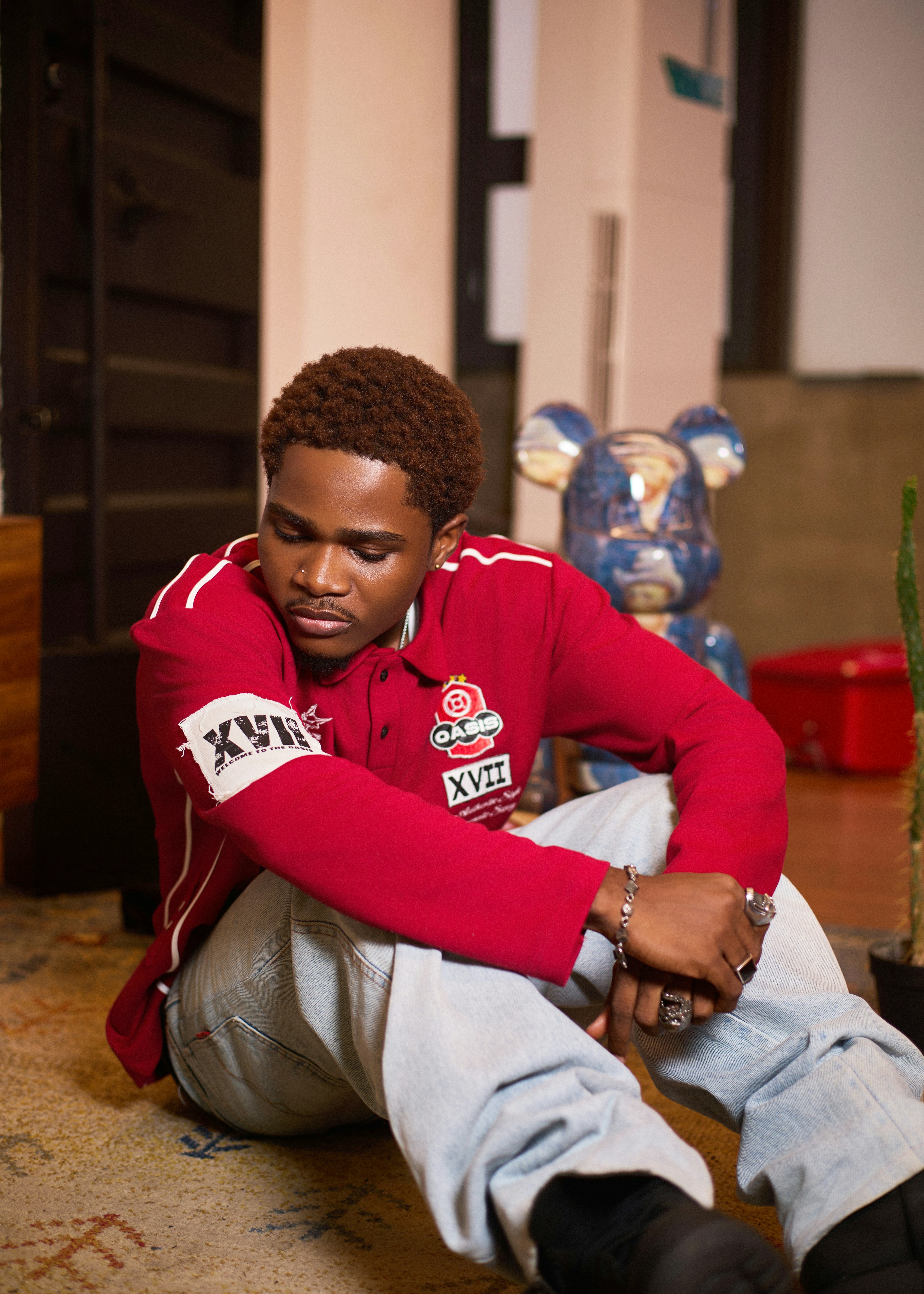 Red Hoodie Reverie: A Quiet Moment on the Carpeted Floor