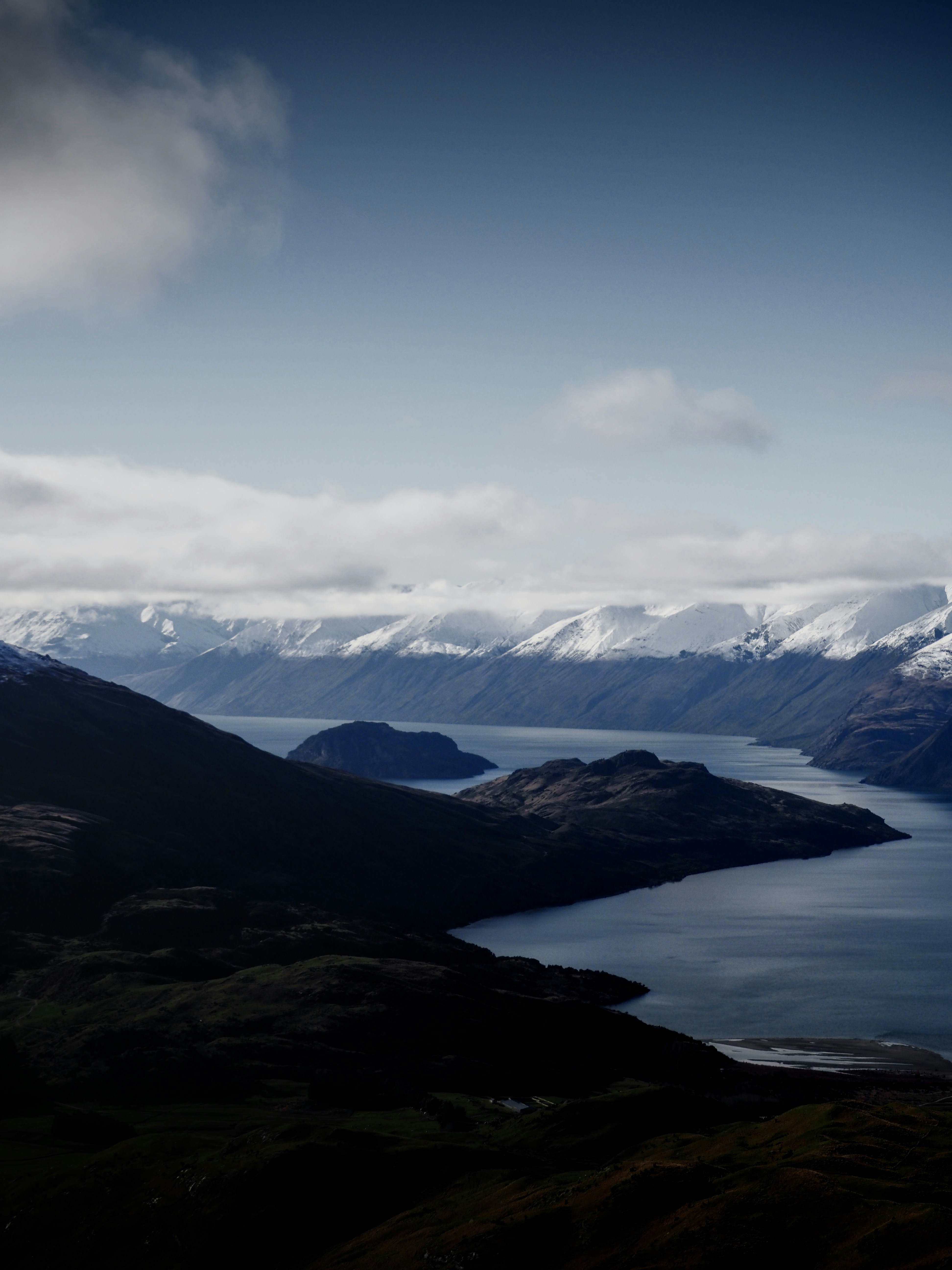 Glacial Fjord Under a Looming Ridge