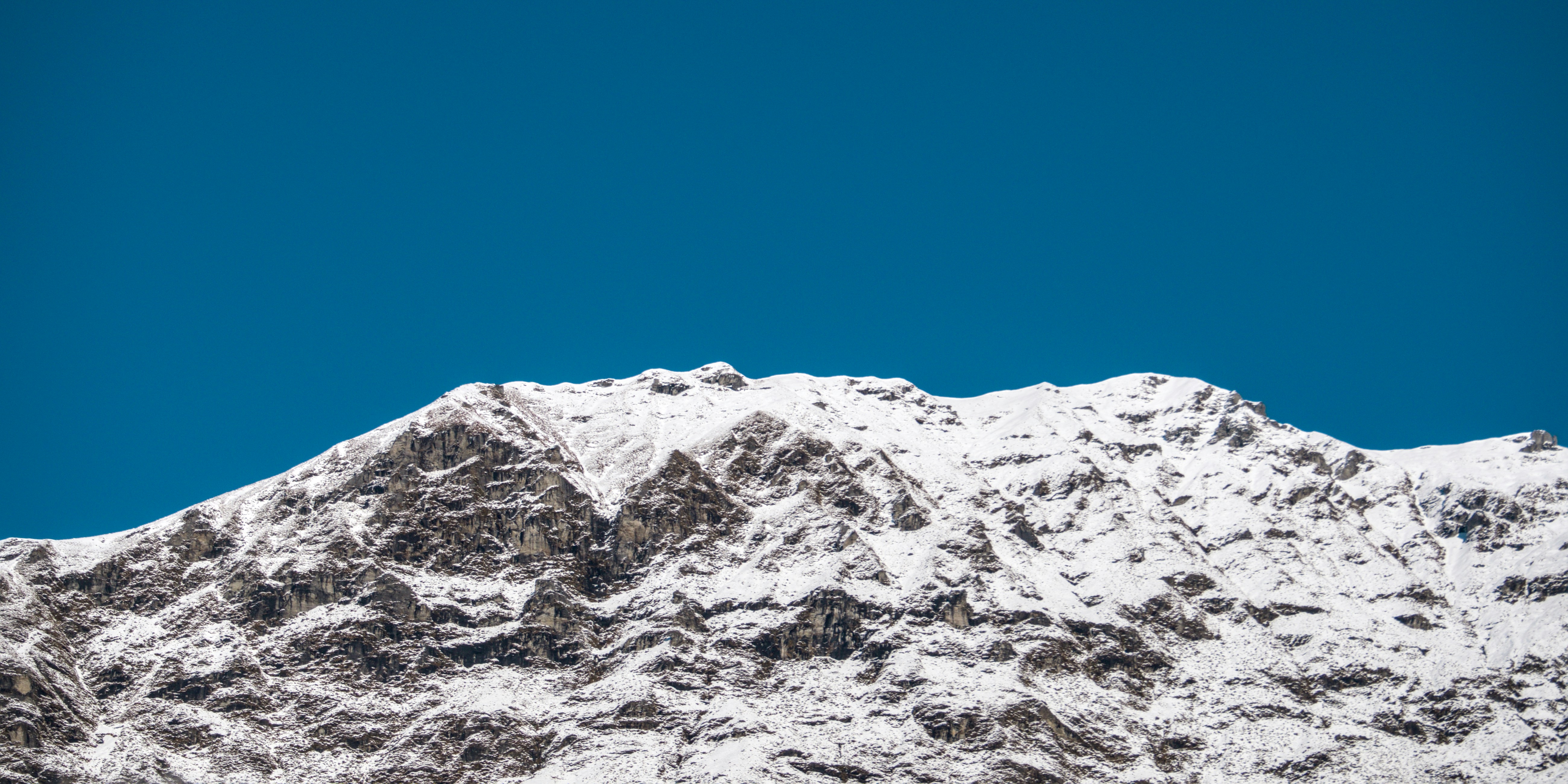 Snow-crowned Ridge Under a Caramel Sky