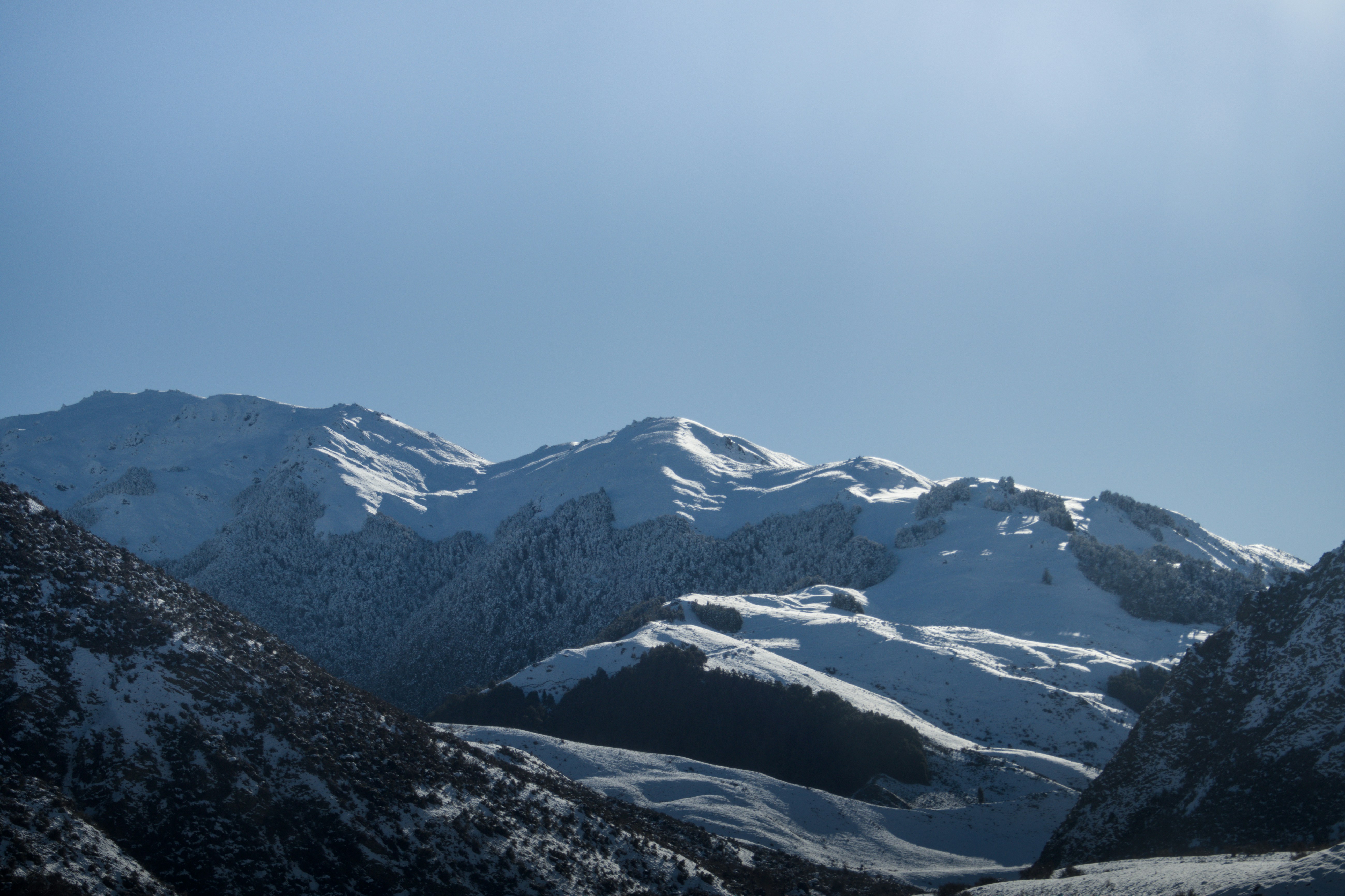 Snowbound Ridge Under a Clear Arctic Sky