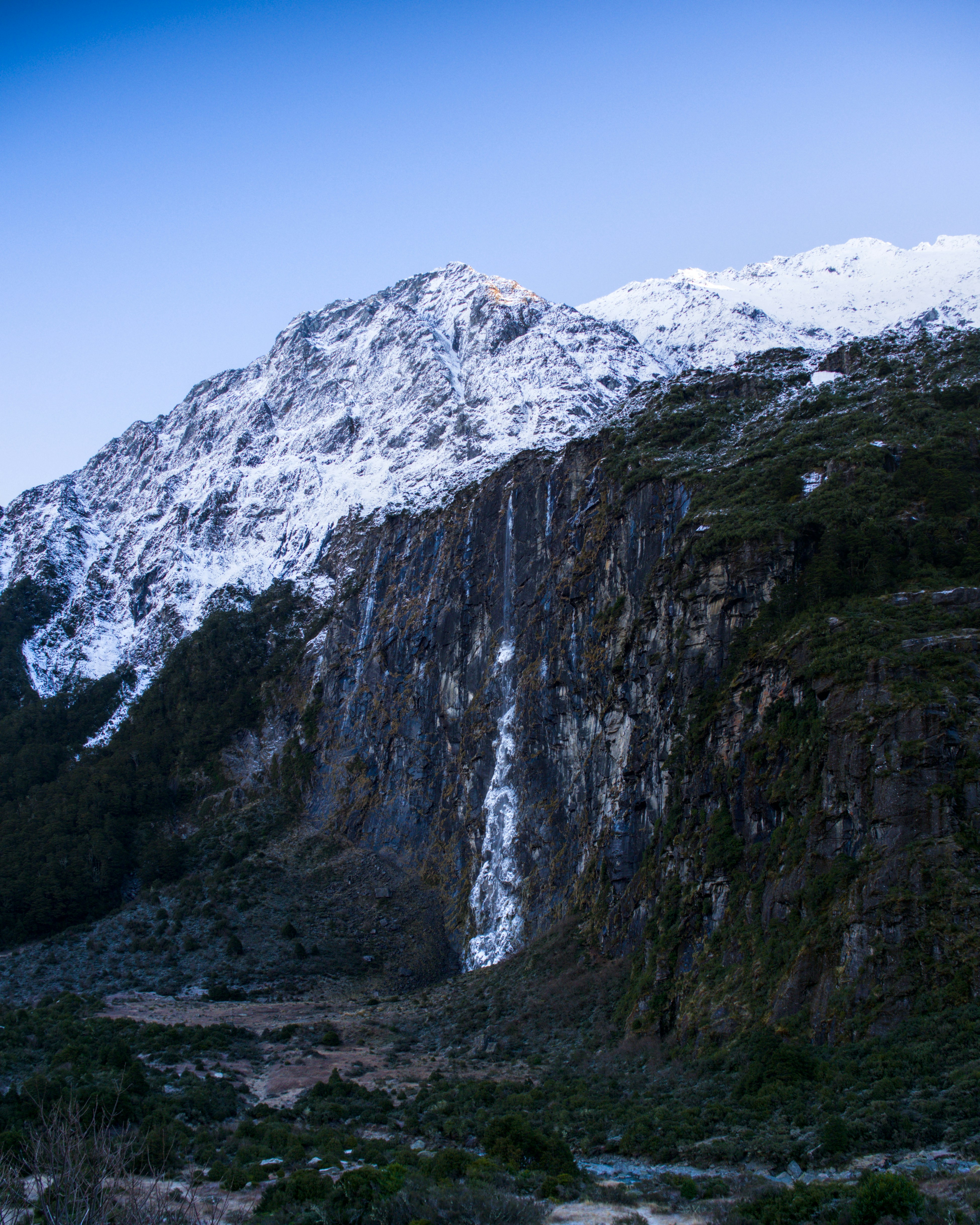 Snow-kissed Ridge Falling into a Hidden Gorge