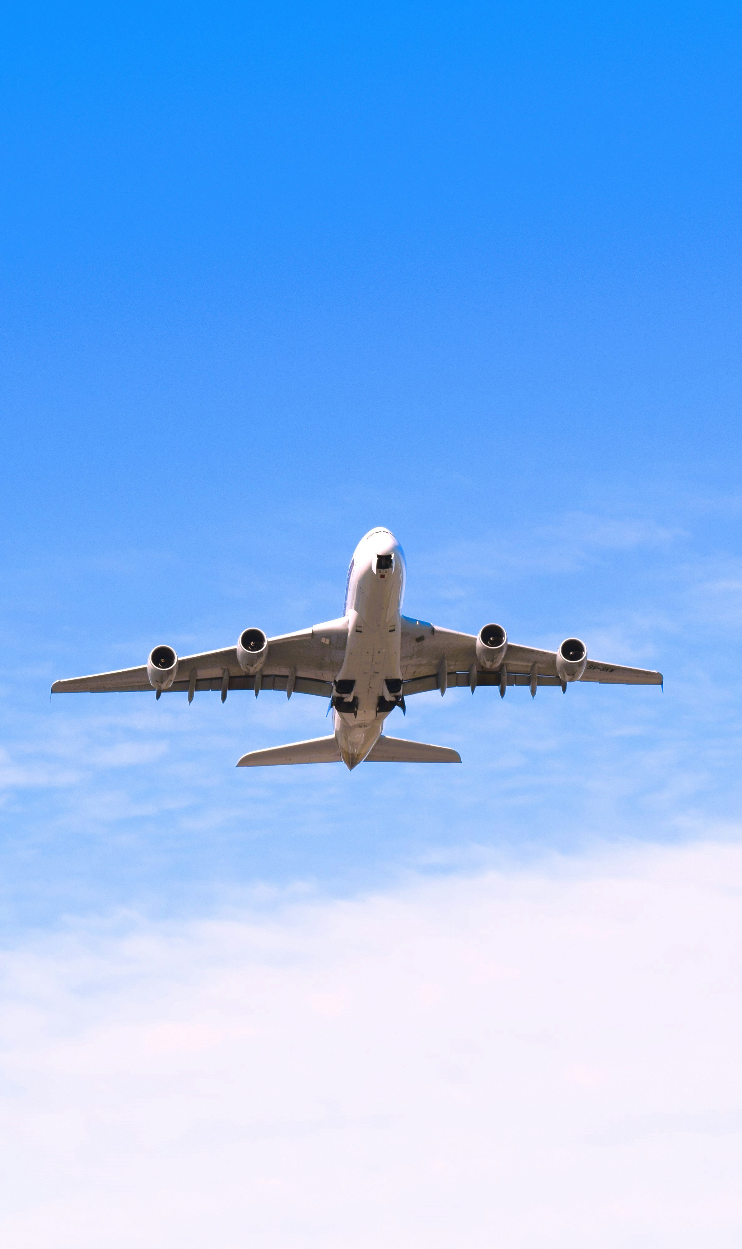 Underbelly Ascend: Aerial Ballet of a Jet Soaring into Blue