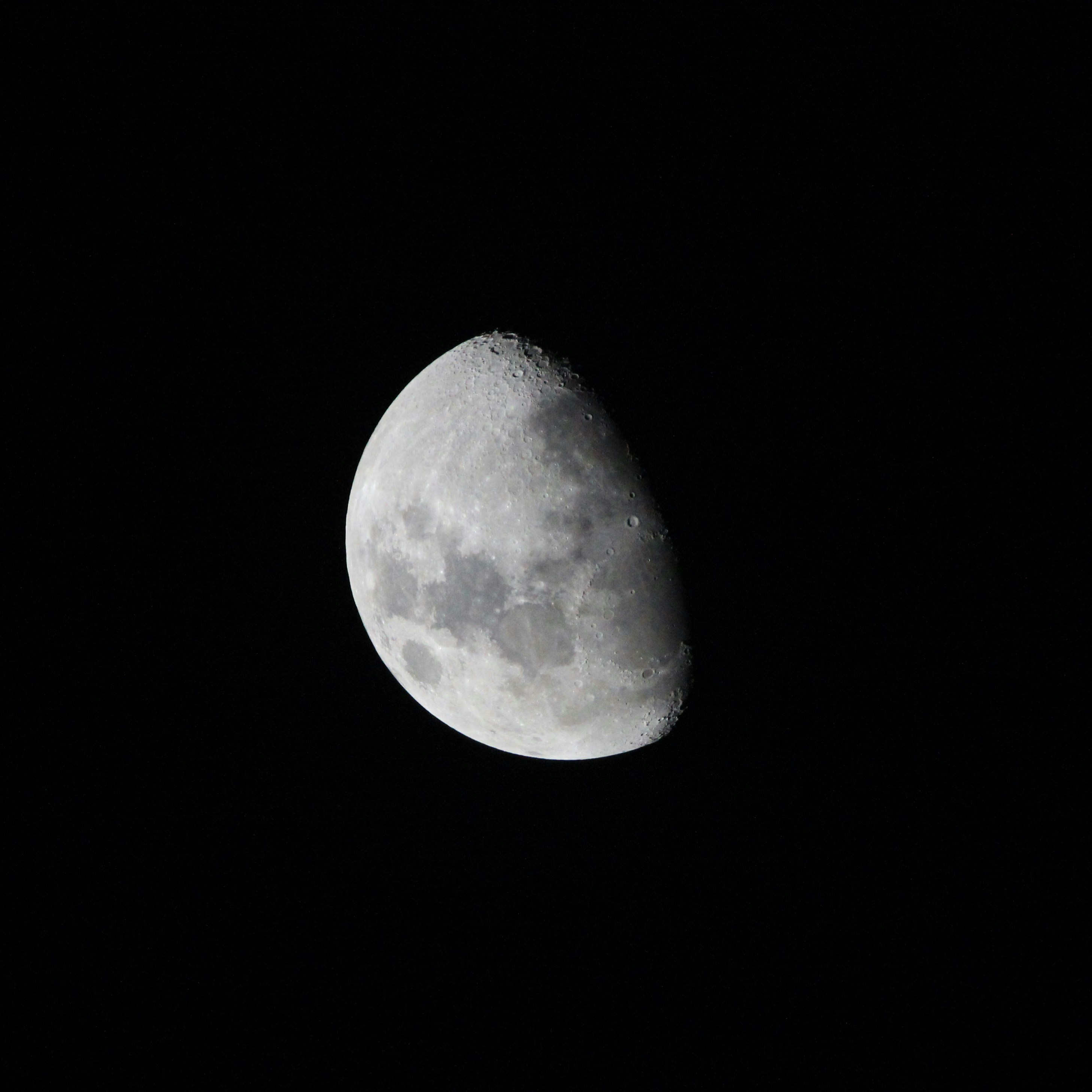 Luminous Crescent: Moonlit Edge Adrift in Velvet Night