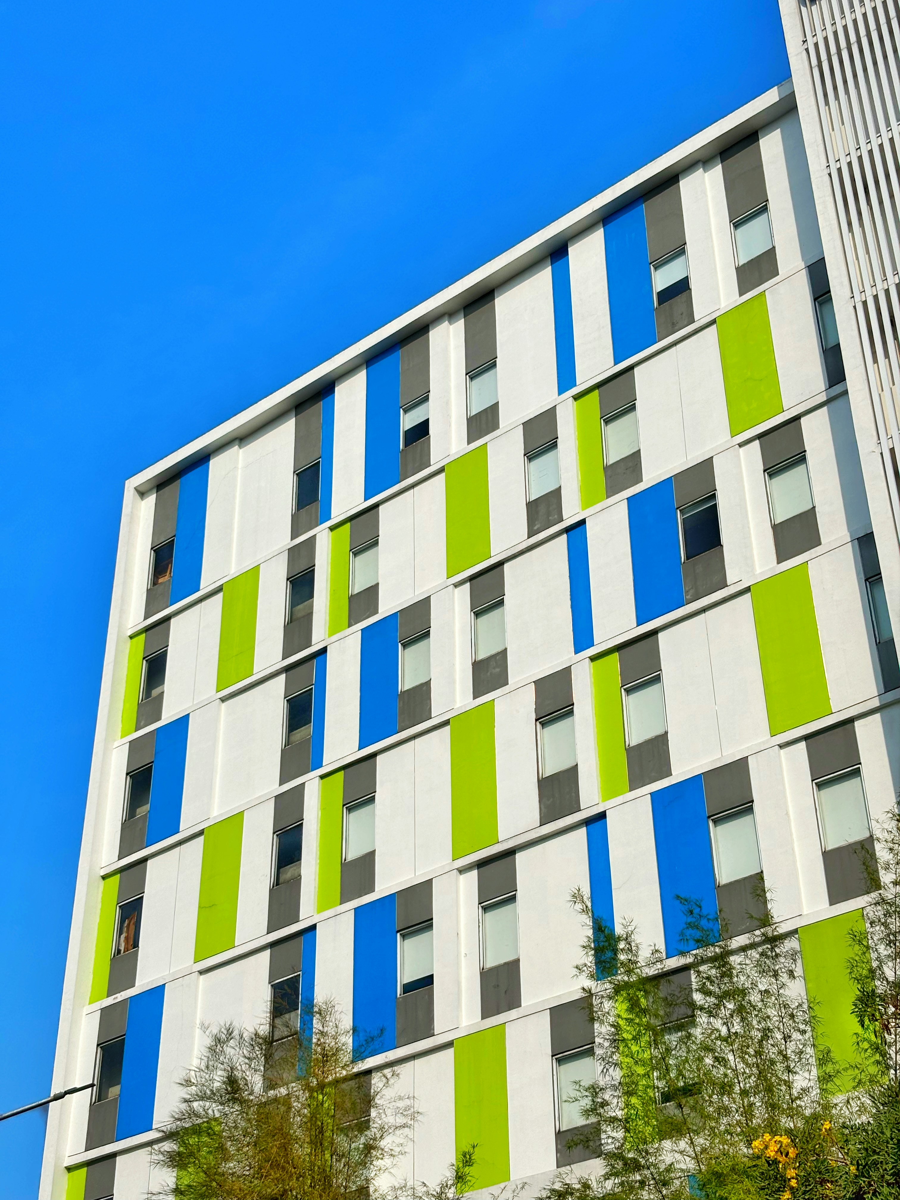 Chromatic Facade: Lively Stripes on a Modern Building