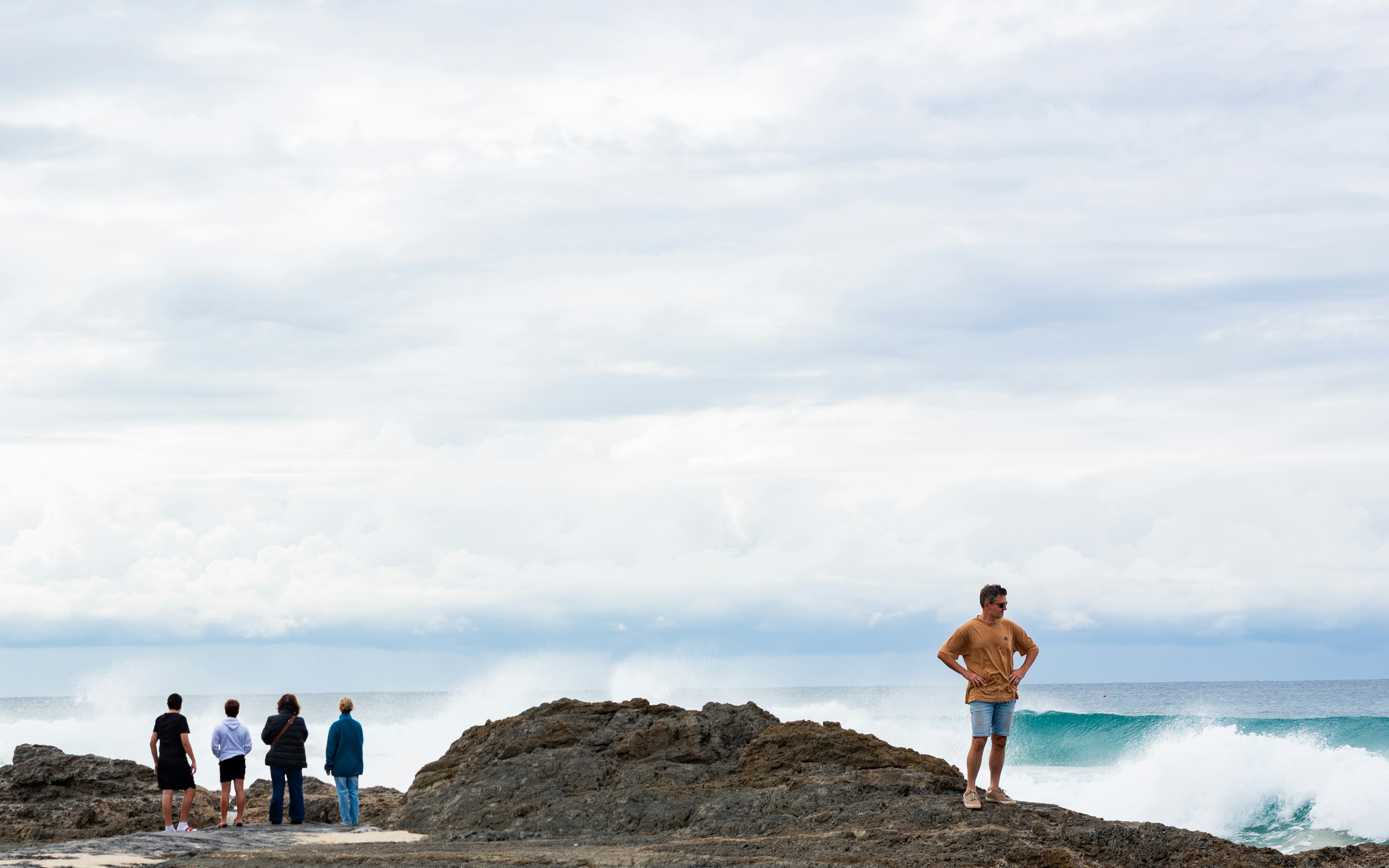 Coastal Cliff Portrait: A Small Group Watches the Breakers
