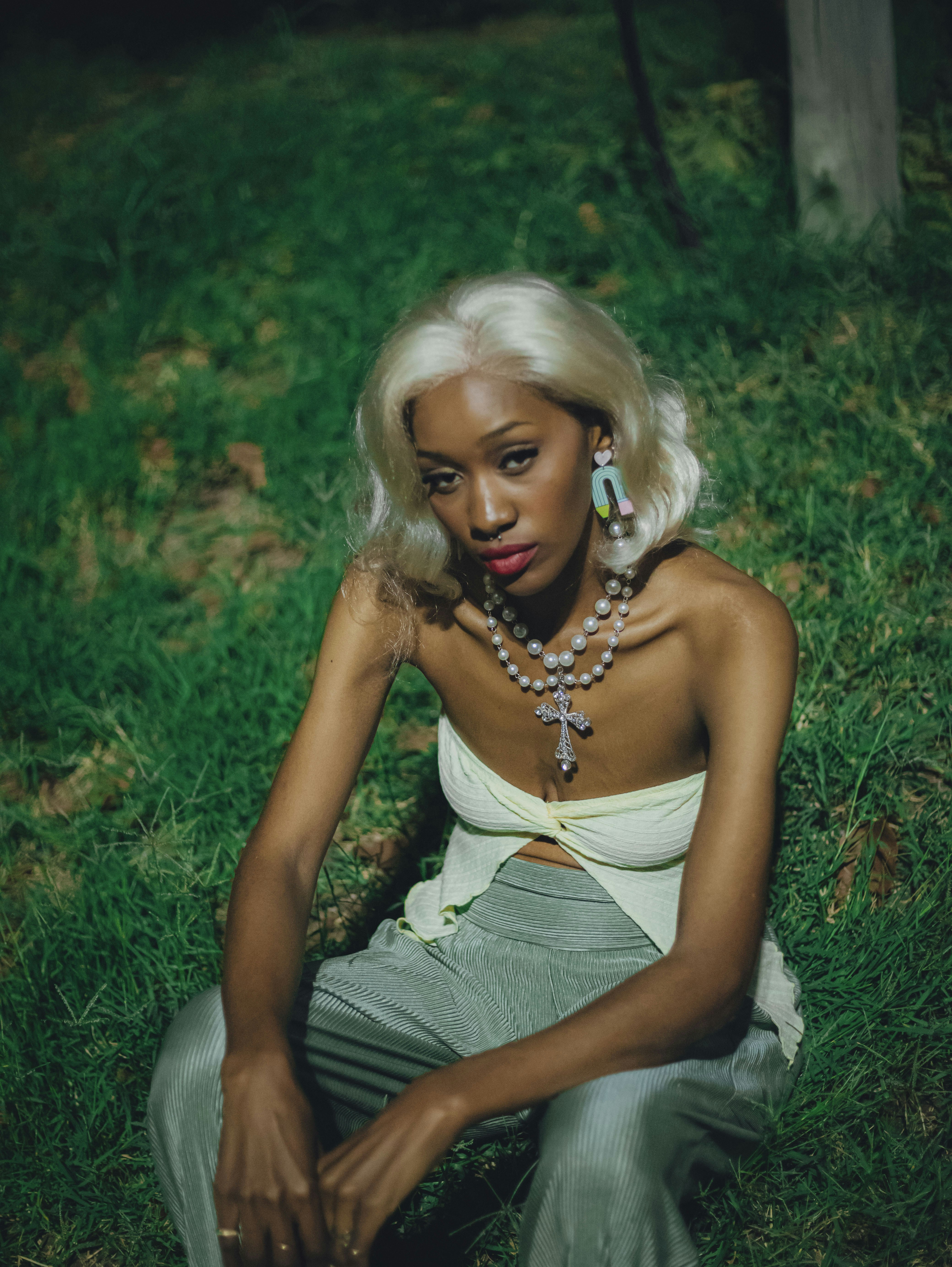 Blonde in Green Light: Neon Jewelry and Velvet Night