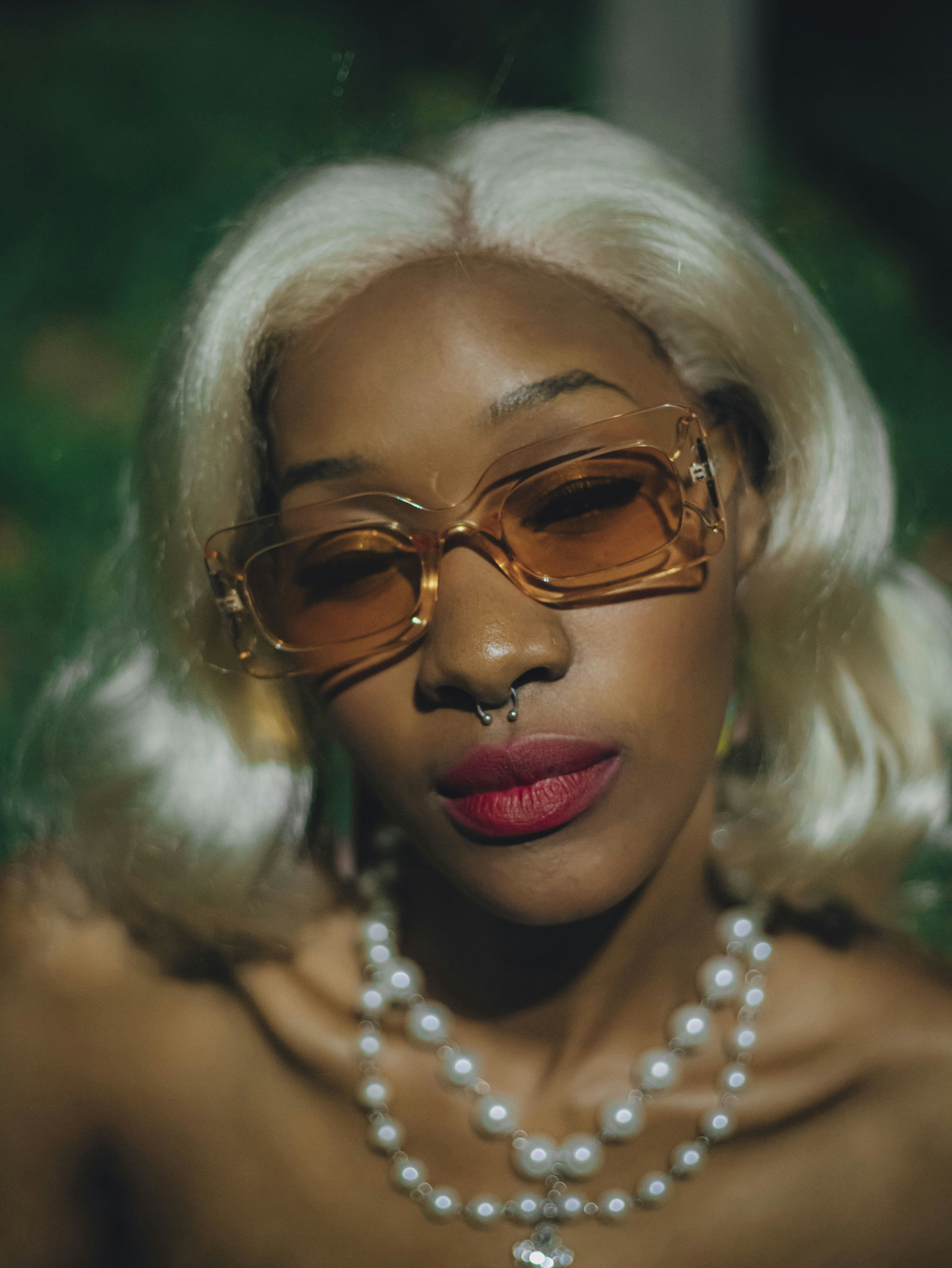 Sunlit Confidence: Pearls, Shades, and Blonde Starlight