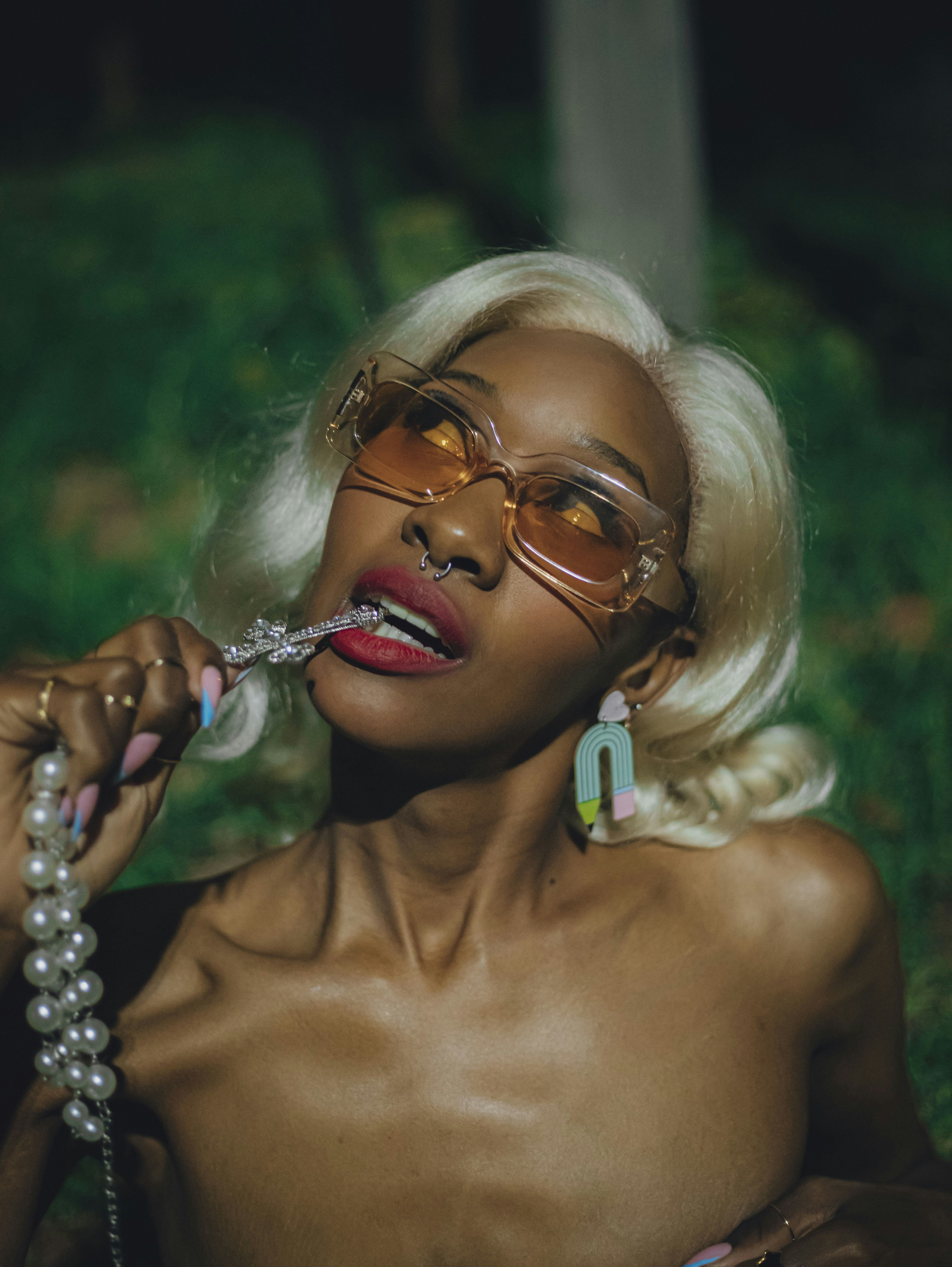 Blonde attitude under neon-green night