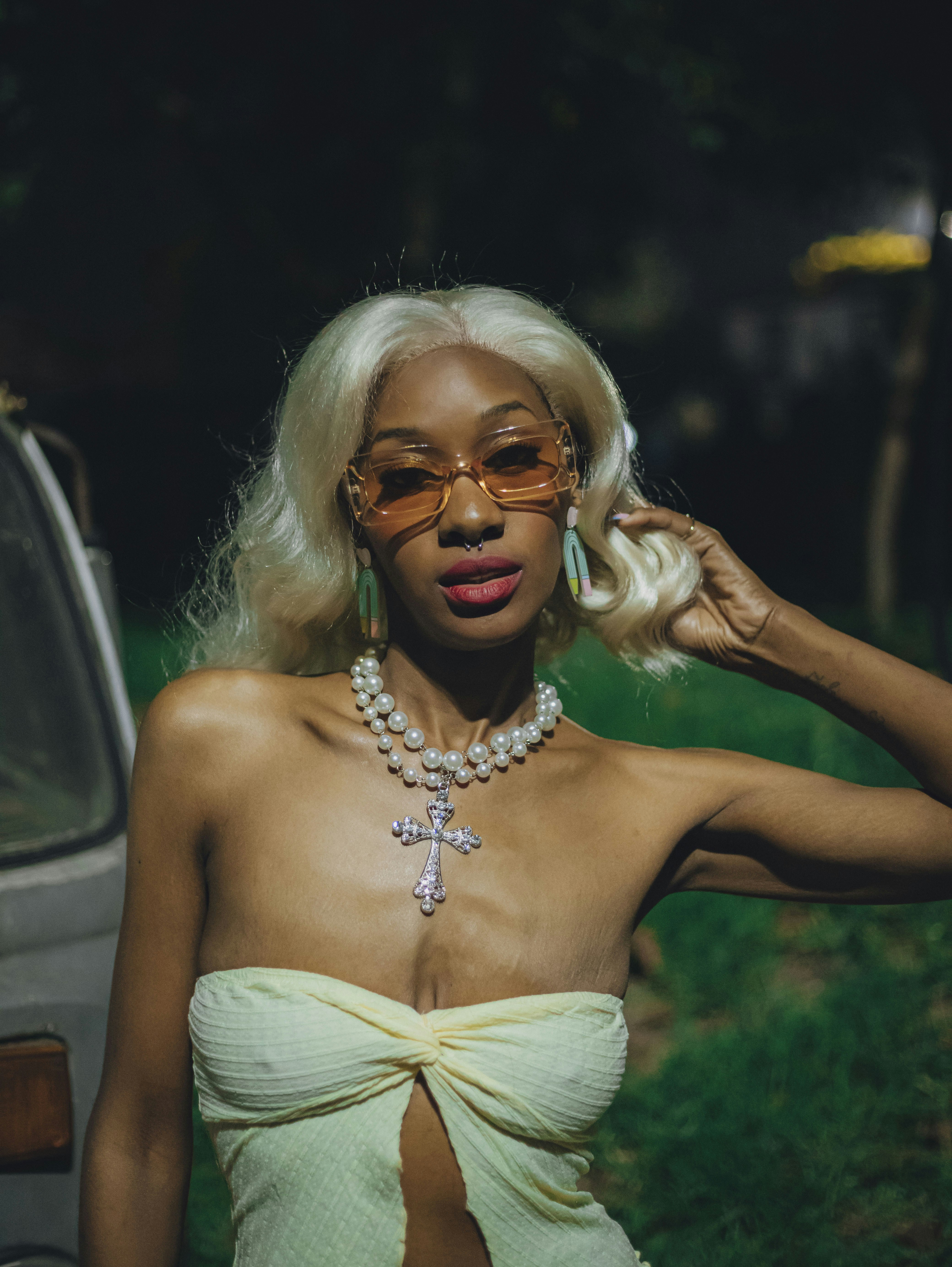 Neon Diva: Nightlight and Pearls Under Streetcar Glow