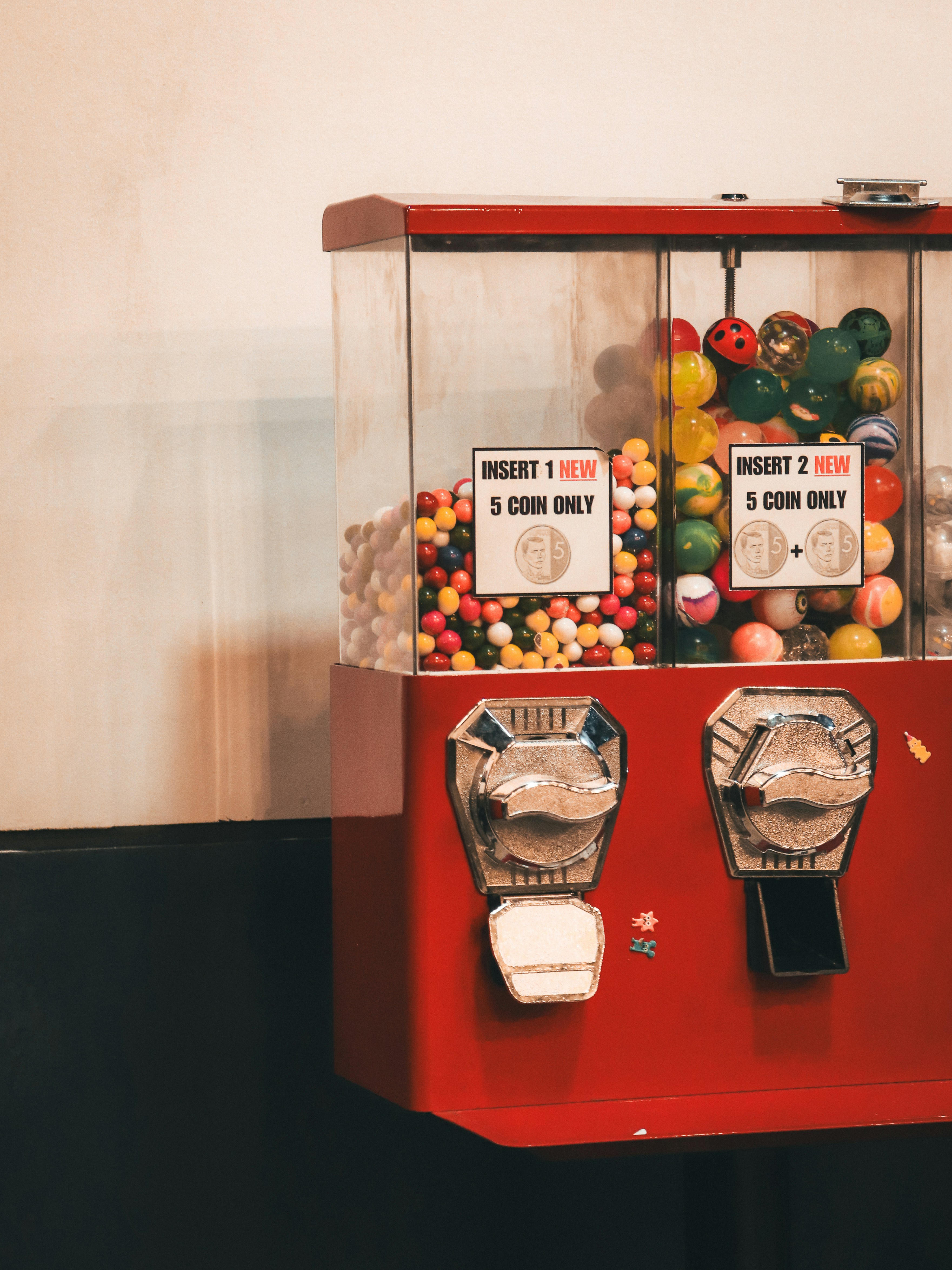 Red Gumball Machine: A Retro Corner in Soft Light