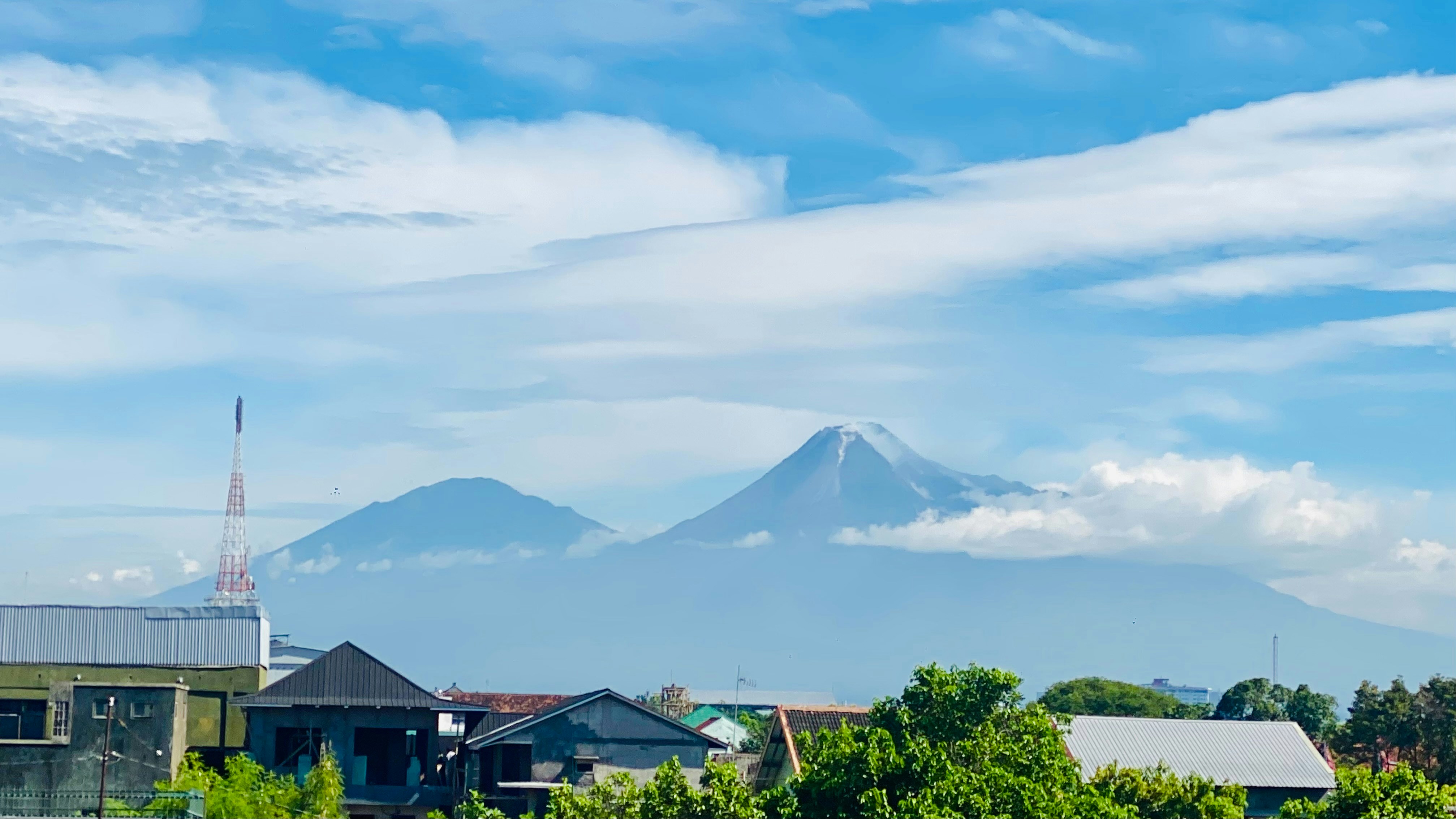 Quiet Valley with Distant Volcanoes and Suburban Front