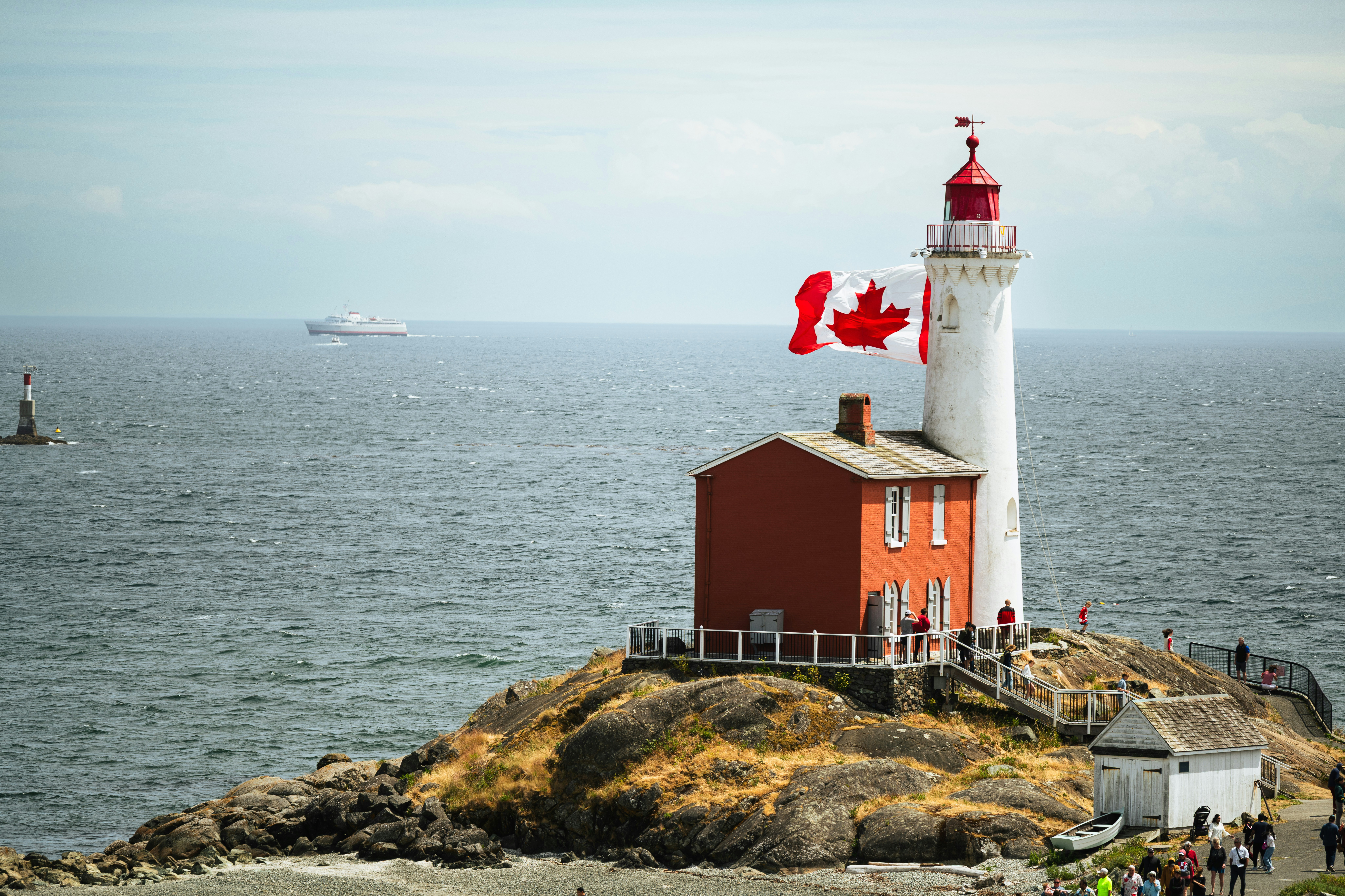 Red Beacon: A Lighthouse Perched on a Wind-worn Outcropping