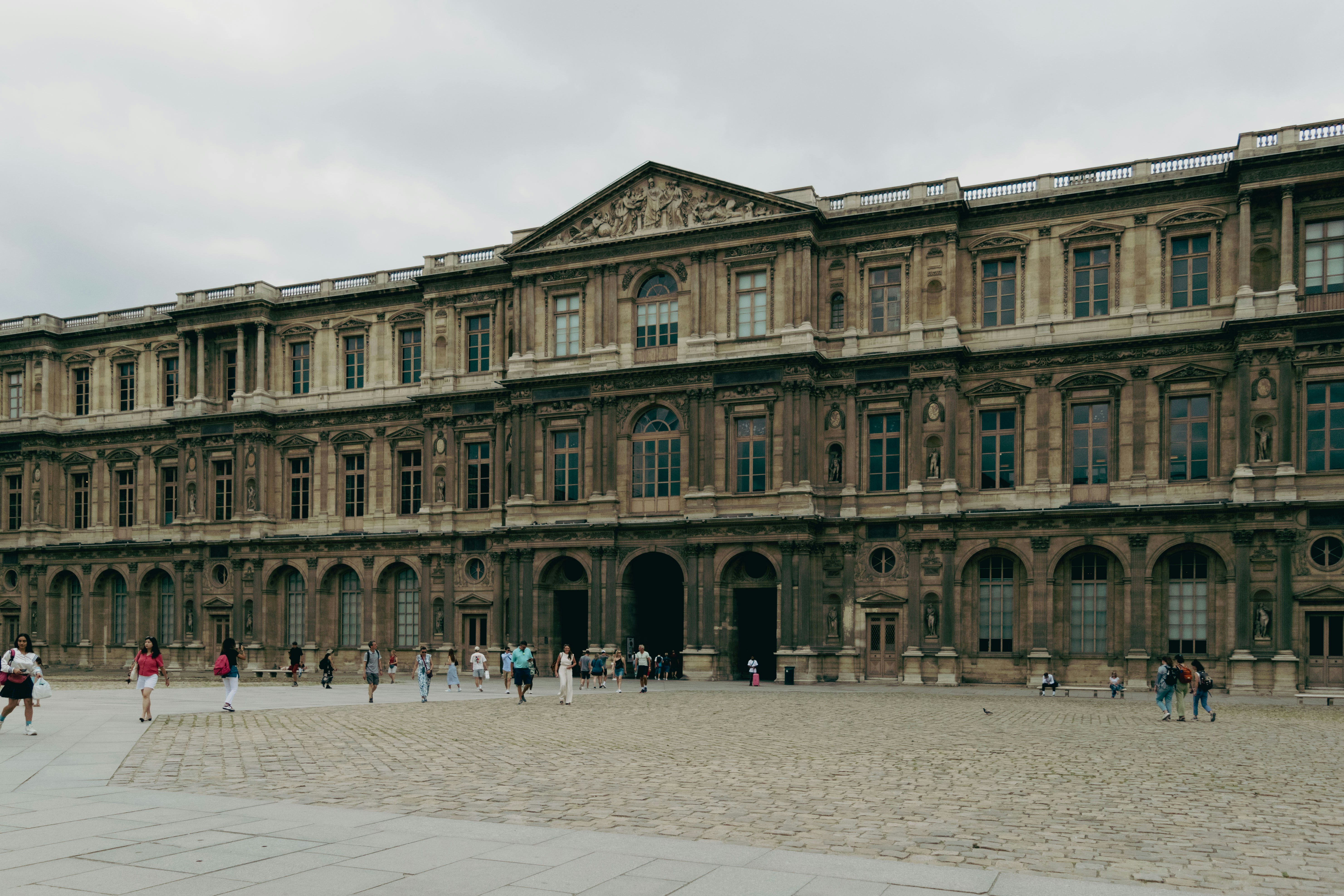 Facade of Grandeur: Visitors at the Palace Courtyard