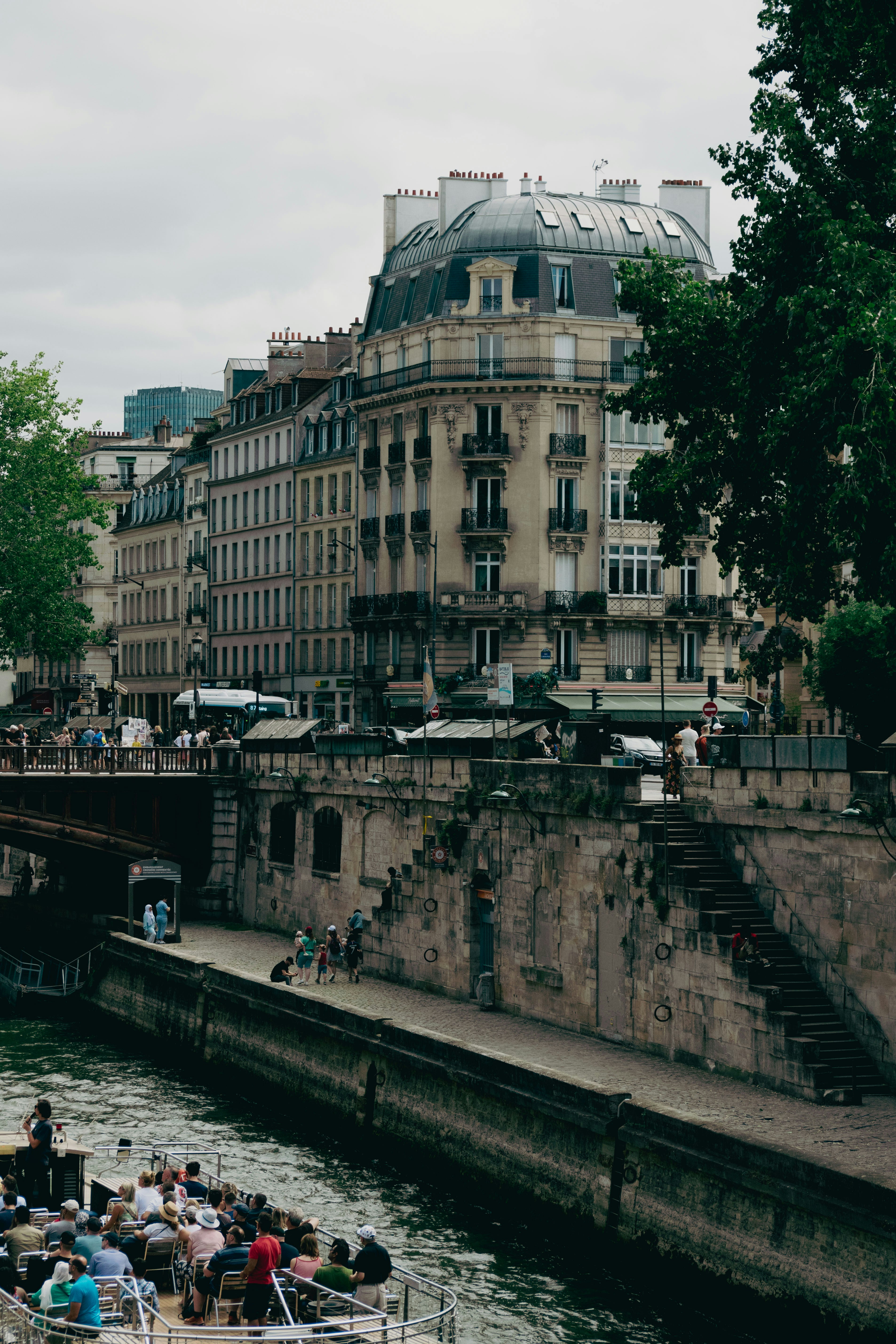 Parisian Riverside Facade Under Autumn Clouds