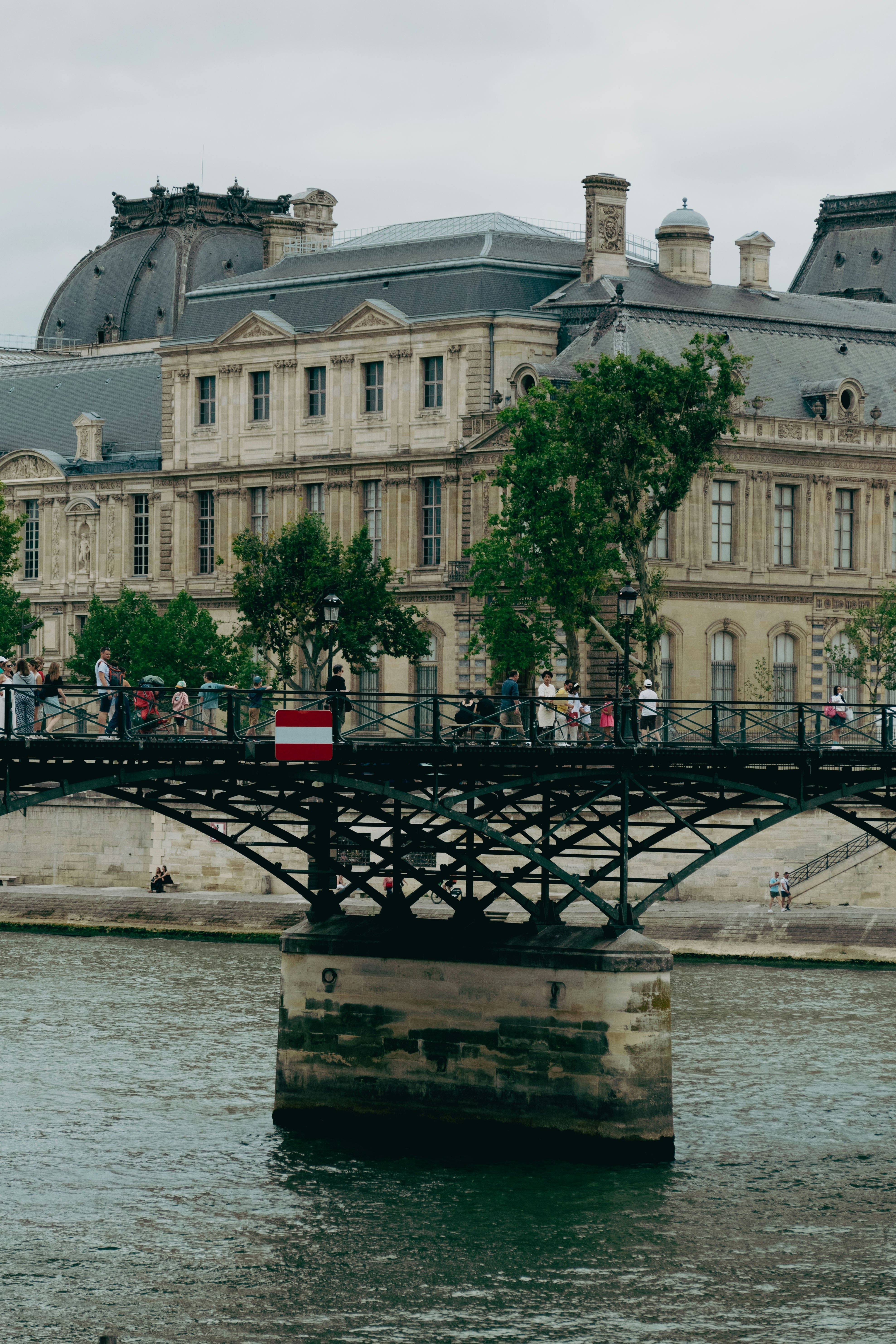 Bridge Over the Seine: Stone Facades and Timeless Transit