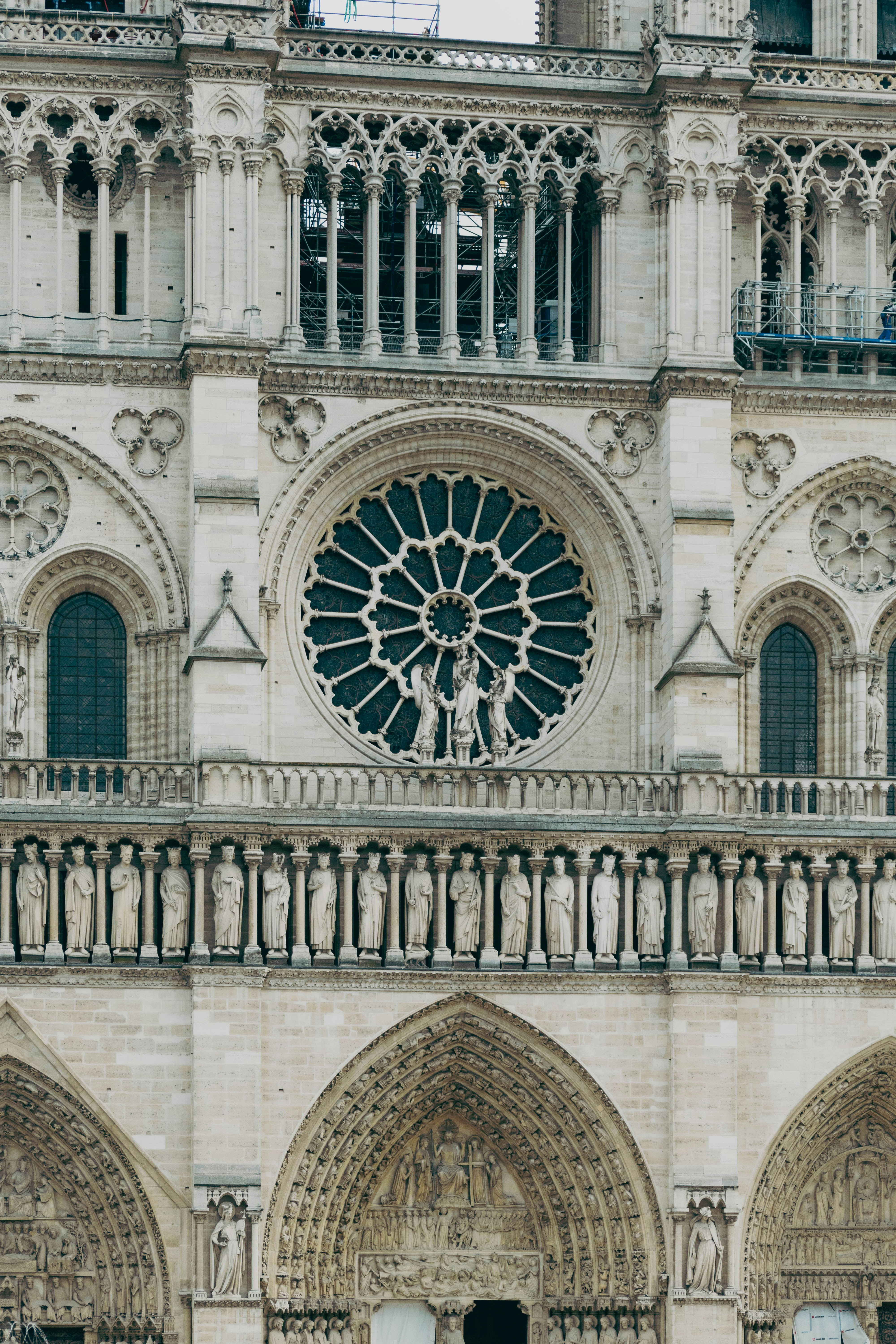 Rose Window Gaze: Carved Grace Above the Portal