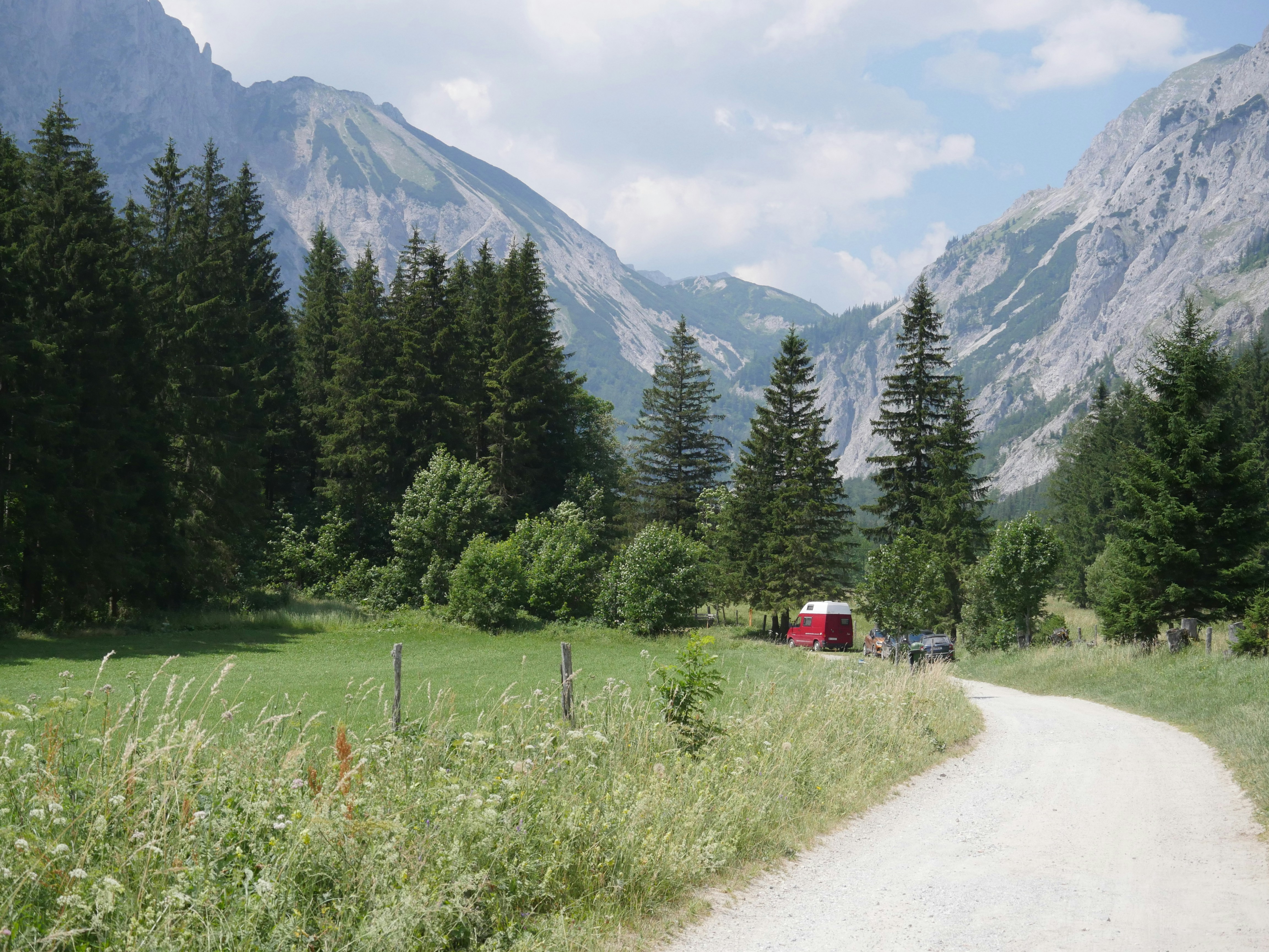 Red Caravan on a Mountain Road