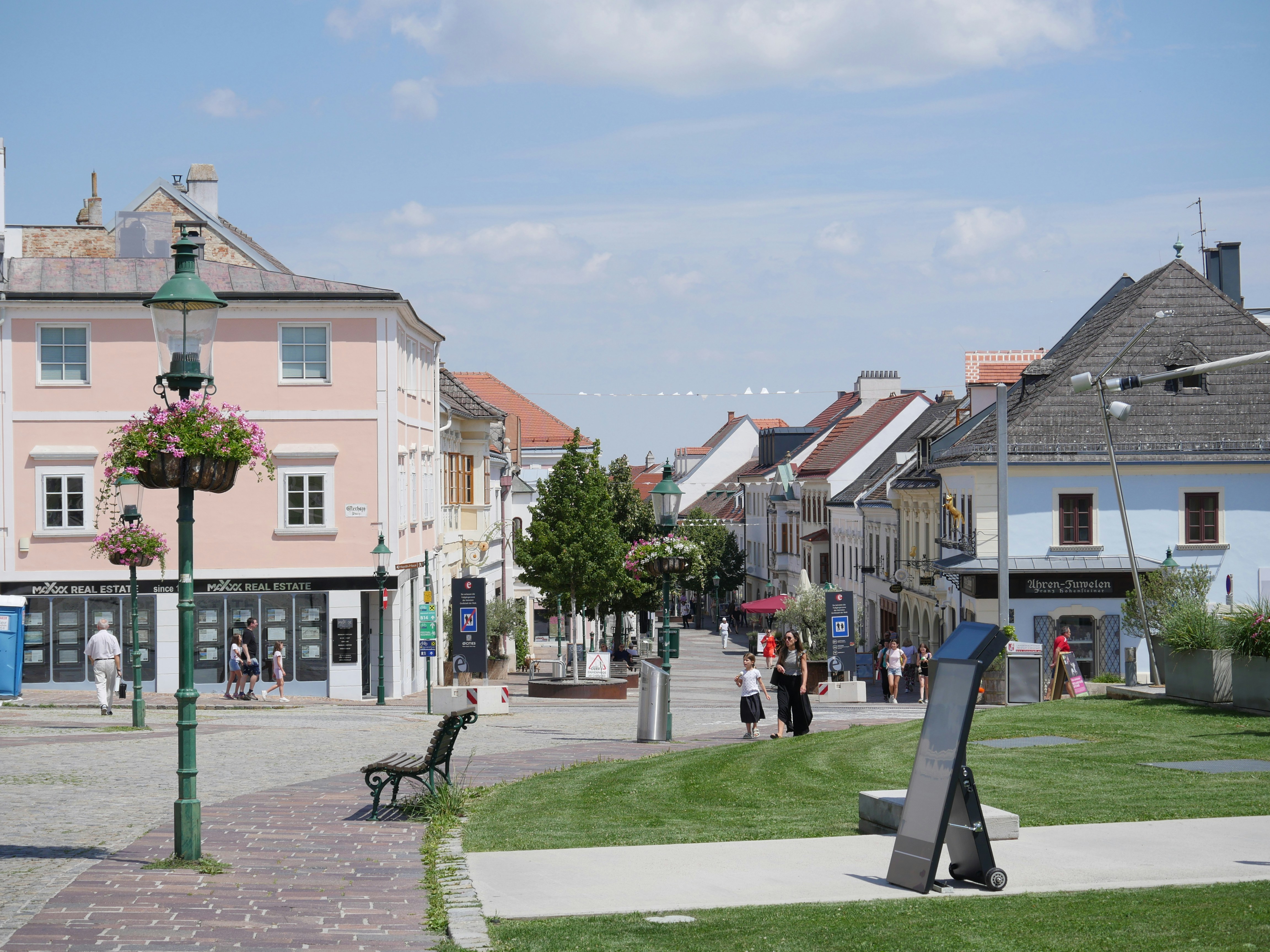 Pastel Street in Bloom: Riverside Plaza in Quiet Sunshine