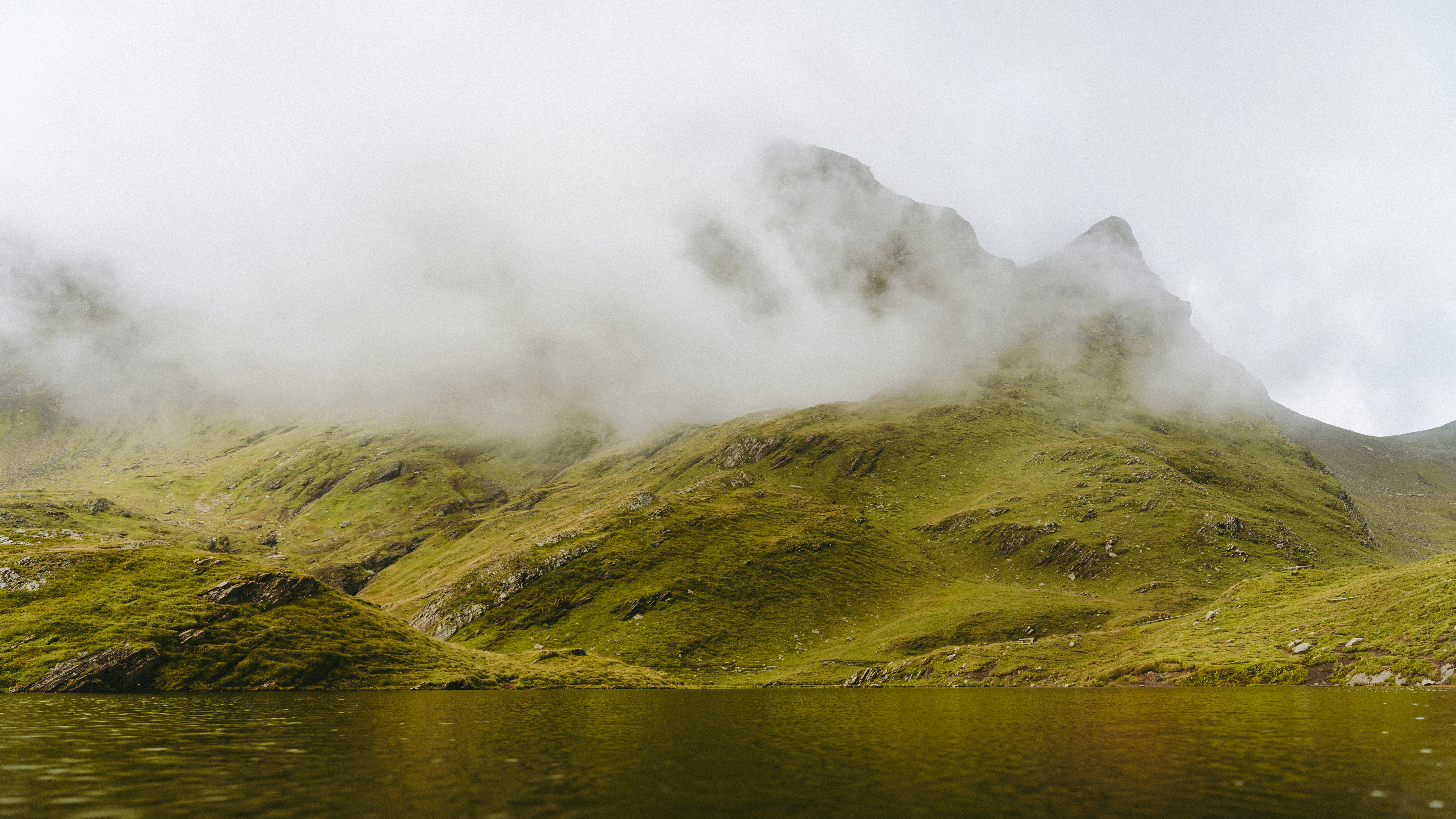 Mist-Clad Peaks Over Quiet Moor